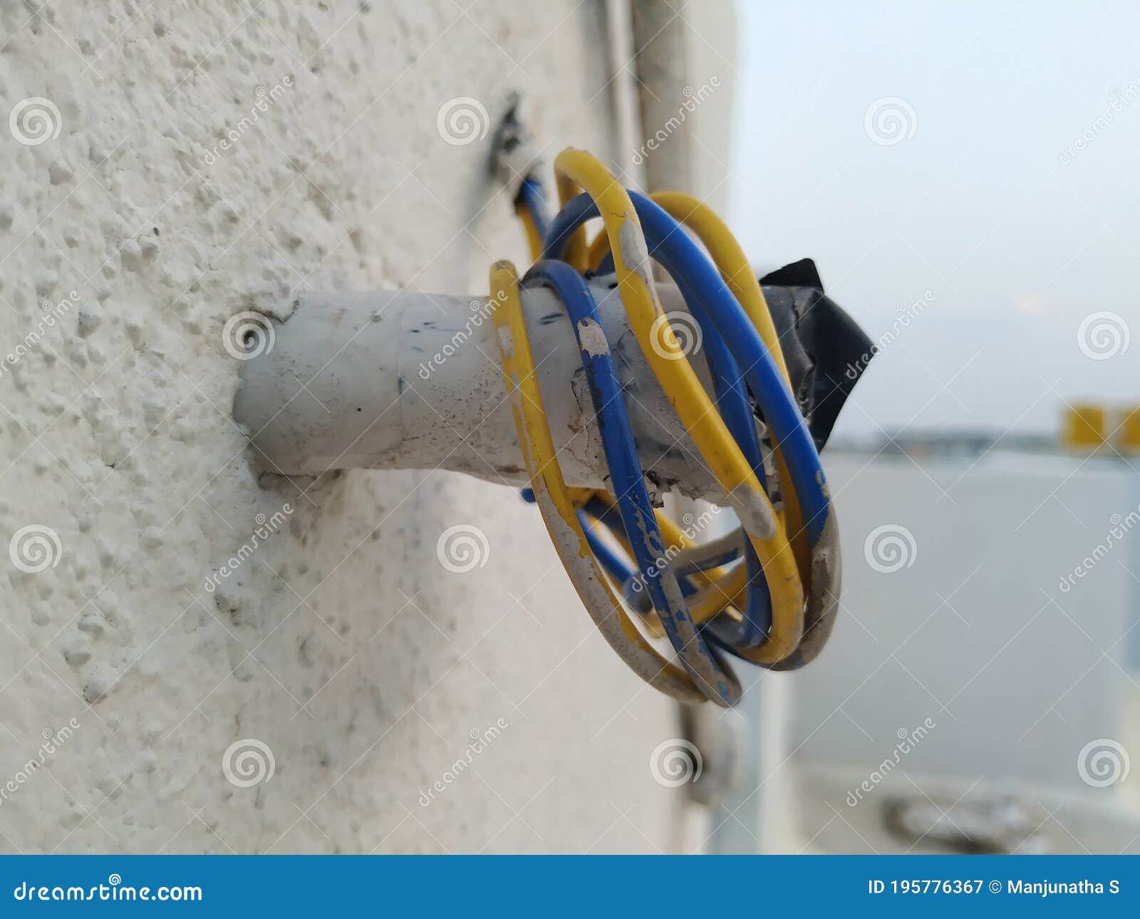 White Wall Fixed Small Plastic Pipe and Remaining Used Electrical Wires ...