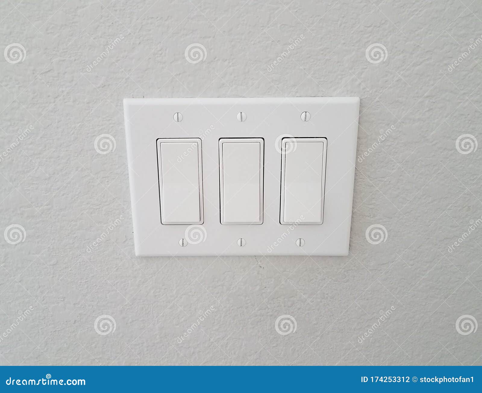 White Wall with Three Buttons or Switches Stock Photo - Image of panel ...