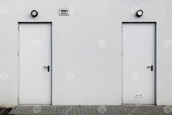 White Wall with Two Closed Doors Stock Photo - Image of doorway, single ...