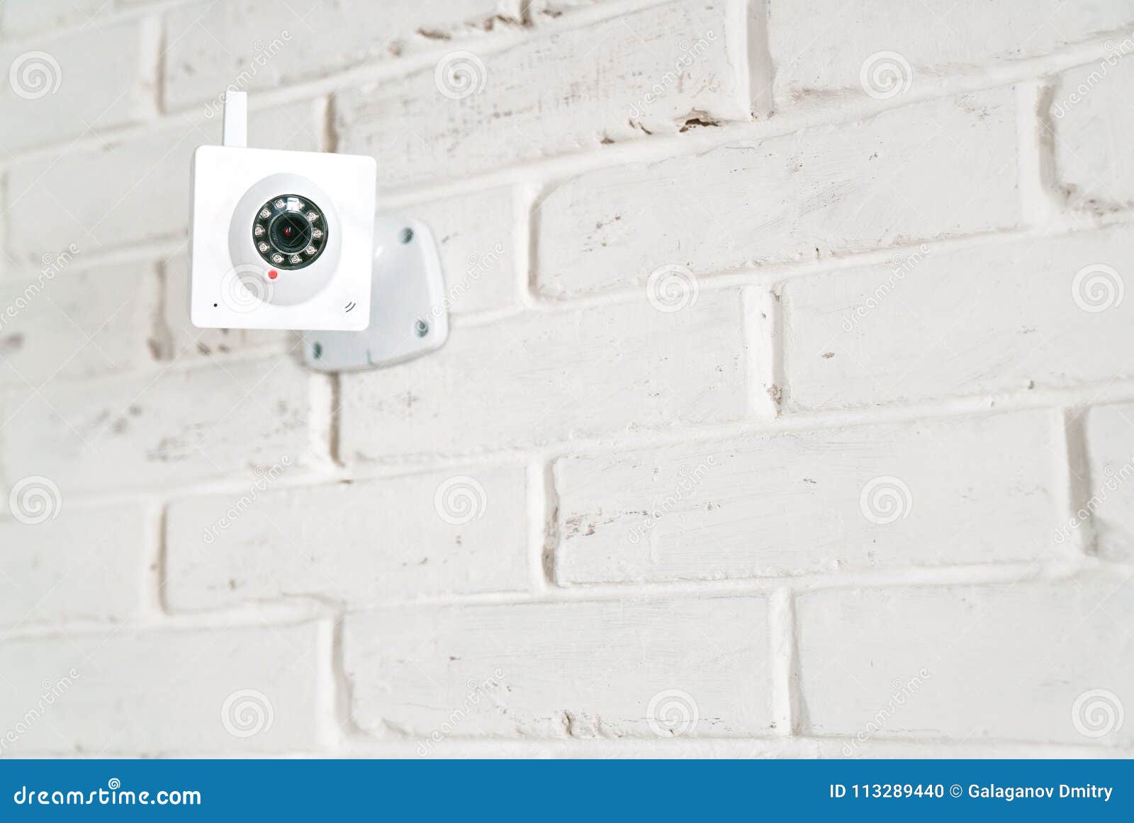 White Web Surveillance Camera on a White Brick Wall. Stock Photo ...