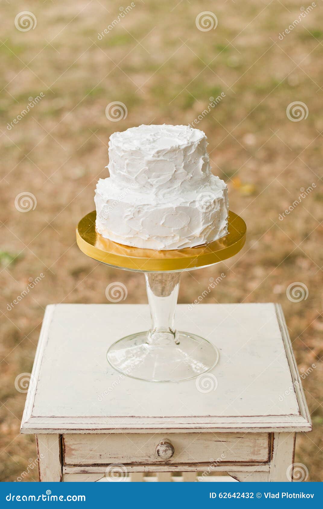 White Wedding Cake on Table Stock Photo - Image of white, sweets: 62642432