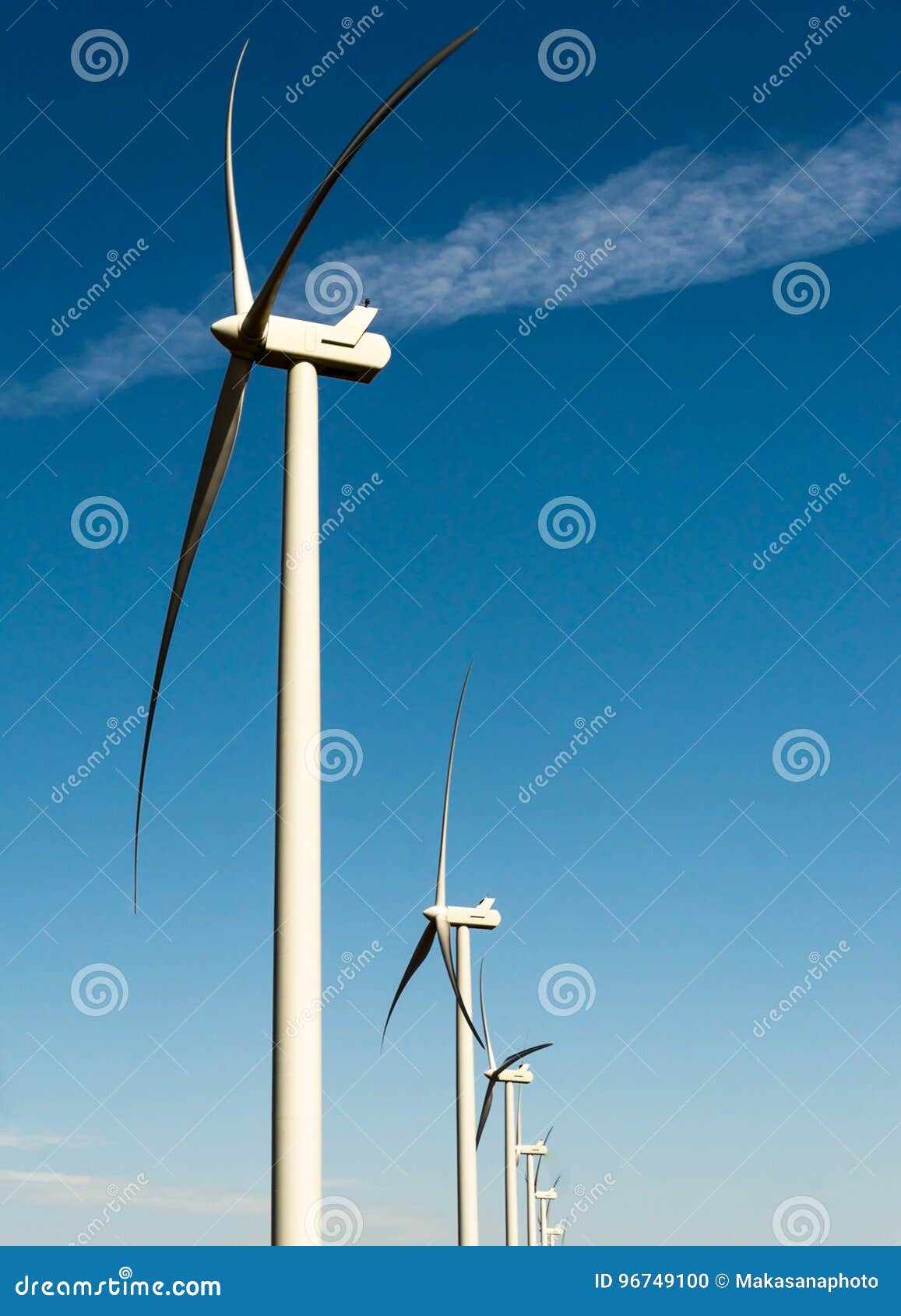 White Wind Turbines on a Wind Farm All in a Row Stock Photo - Image of ...