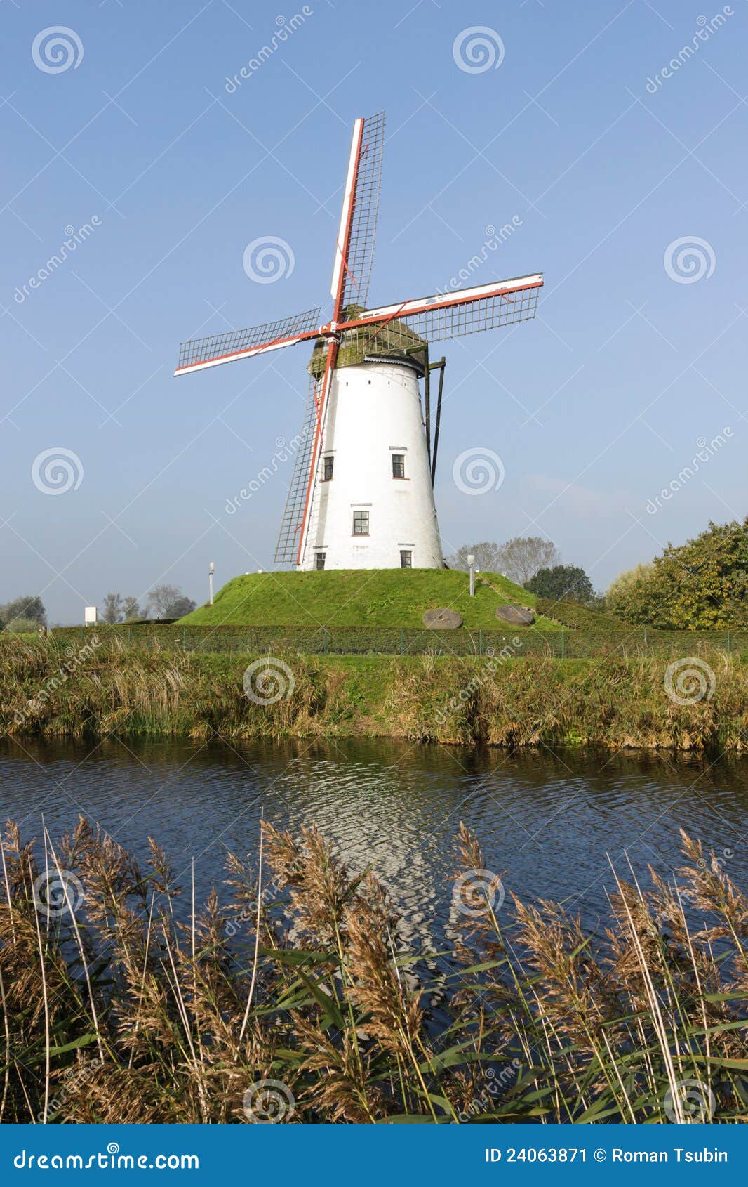White windmill near river stock image. Image of europe - 24063871