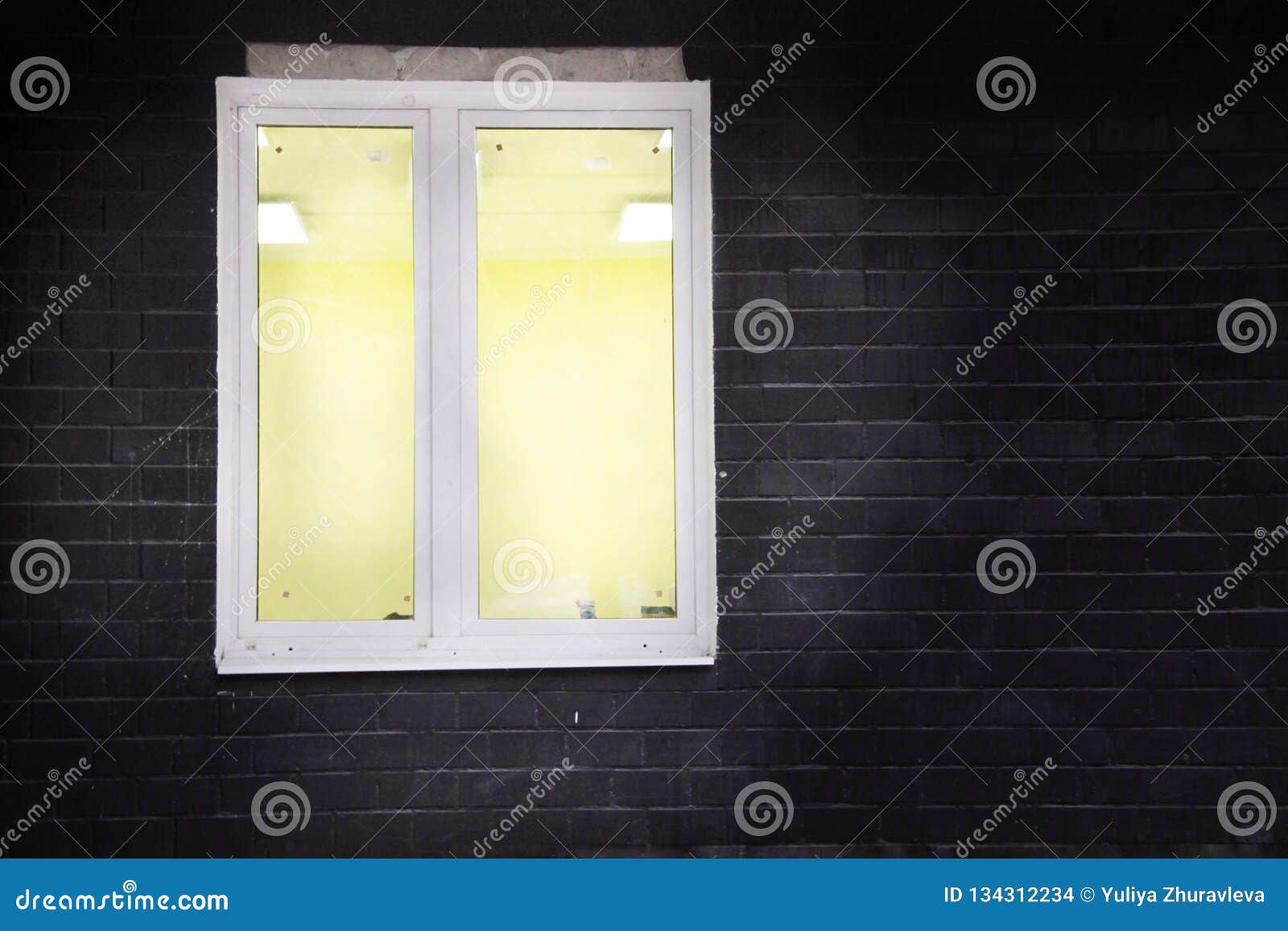 White Window Frame, Yellow Light Inside The Window, On A Black Brick ...