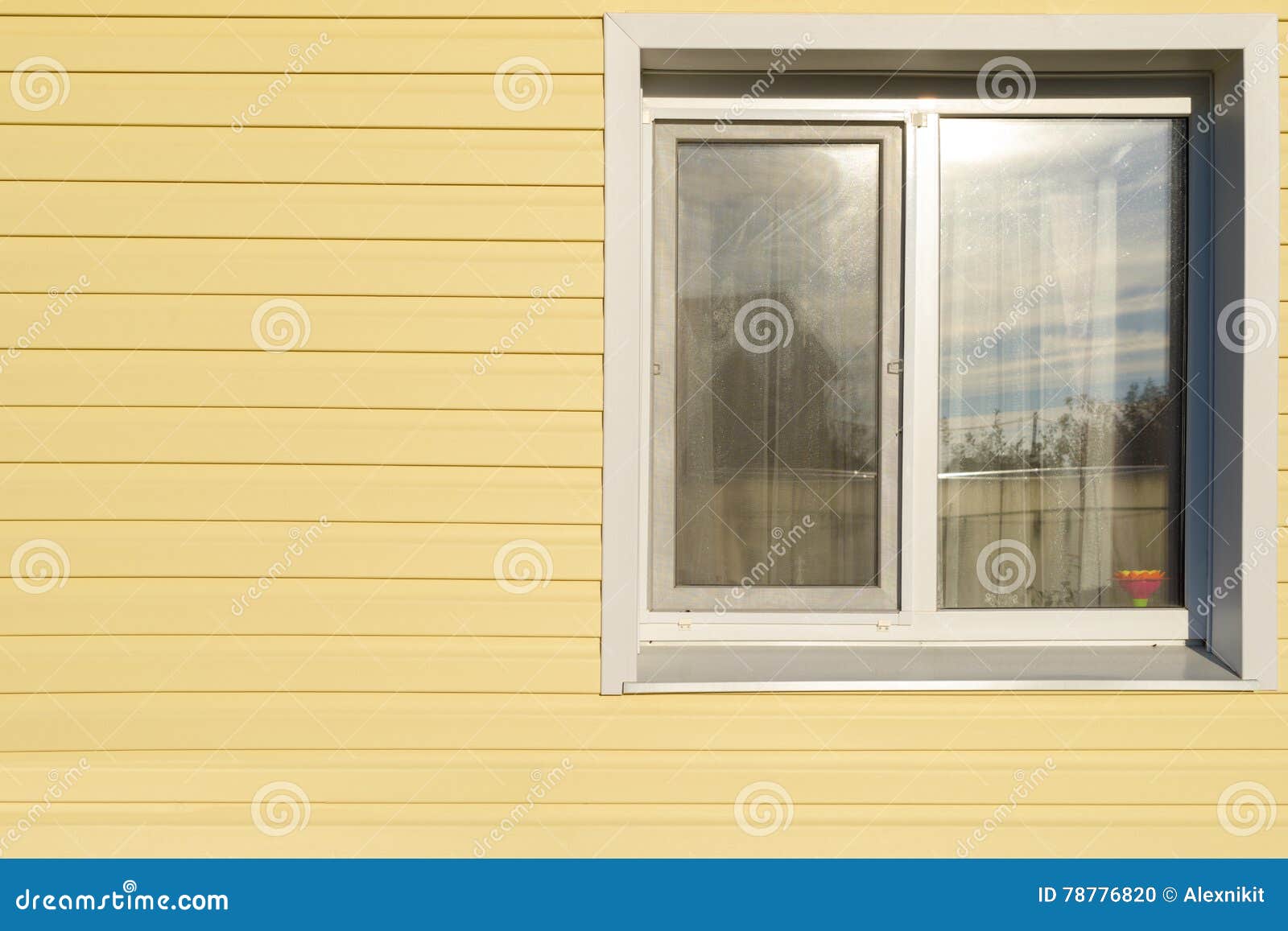 White Window on the Wall Lined with Yellow Siding Stock Photo - Image ...