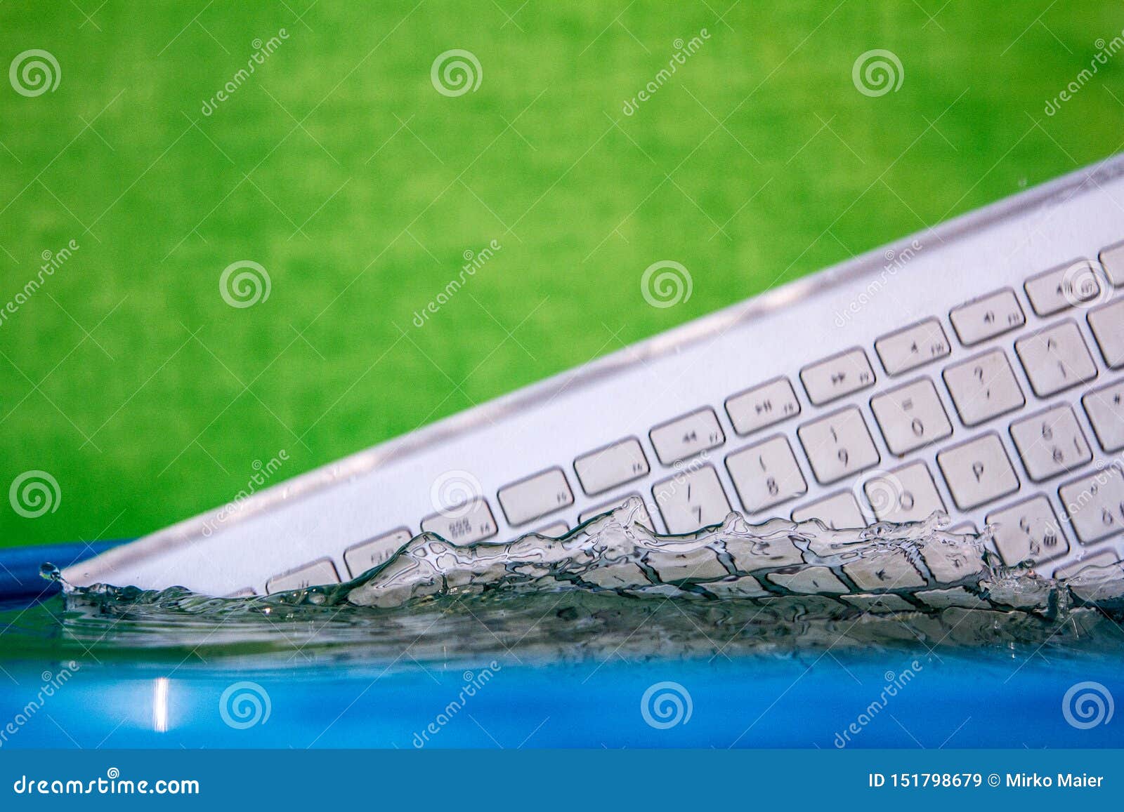 White Wireless Computer Keyboard Falling into the Water Spraying Stock ...