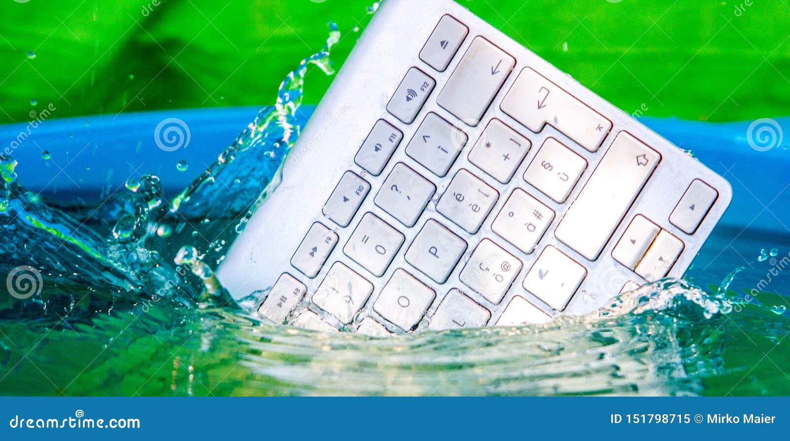 White Wireless Computer Keyboard Falling into the Water Spraying Stock ...