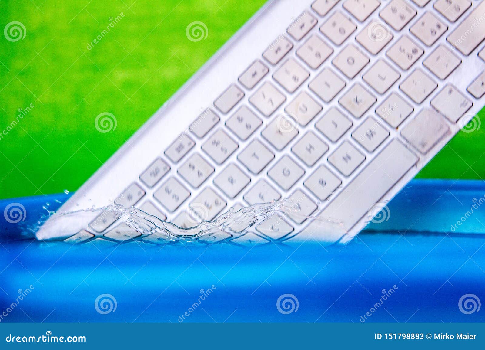 White Wireless Computer Keyboard Falling into the Water Spraying Stock ...