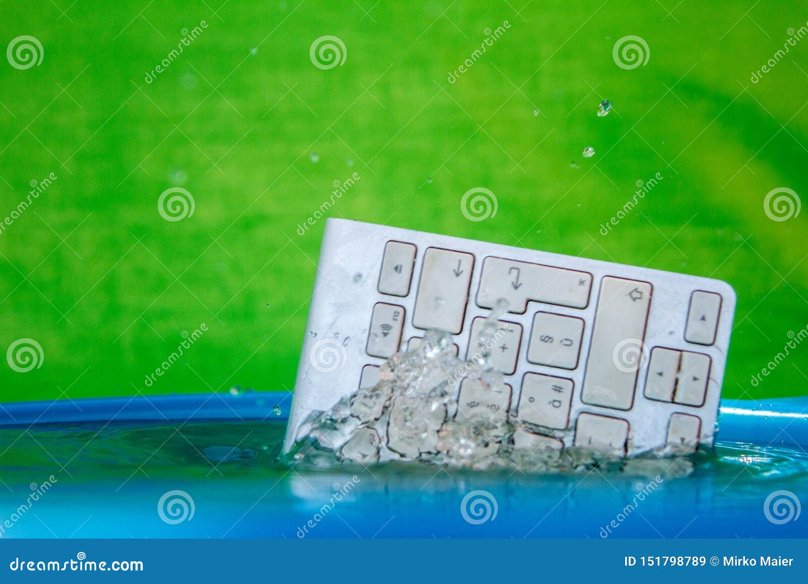 White Wireless Computer Keyboard Falling into the Water Spraying Stock ...