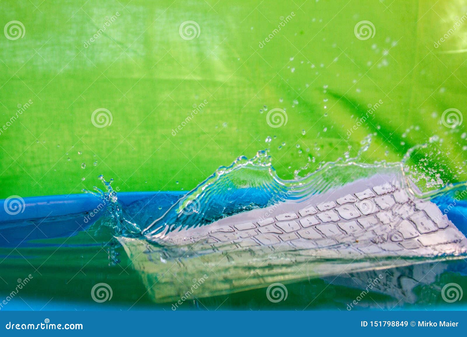 White Wireless Computer Keyboard Falling into the Water Spraying Stock ...