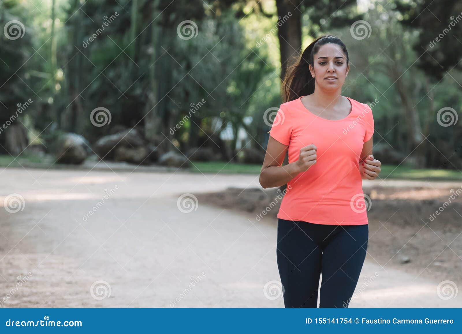 White Woman Smiling Running through the Park Stock Photo - Image of ...