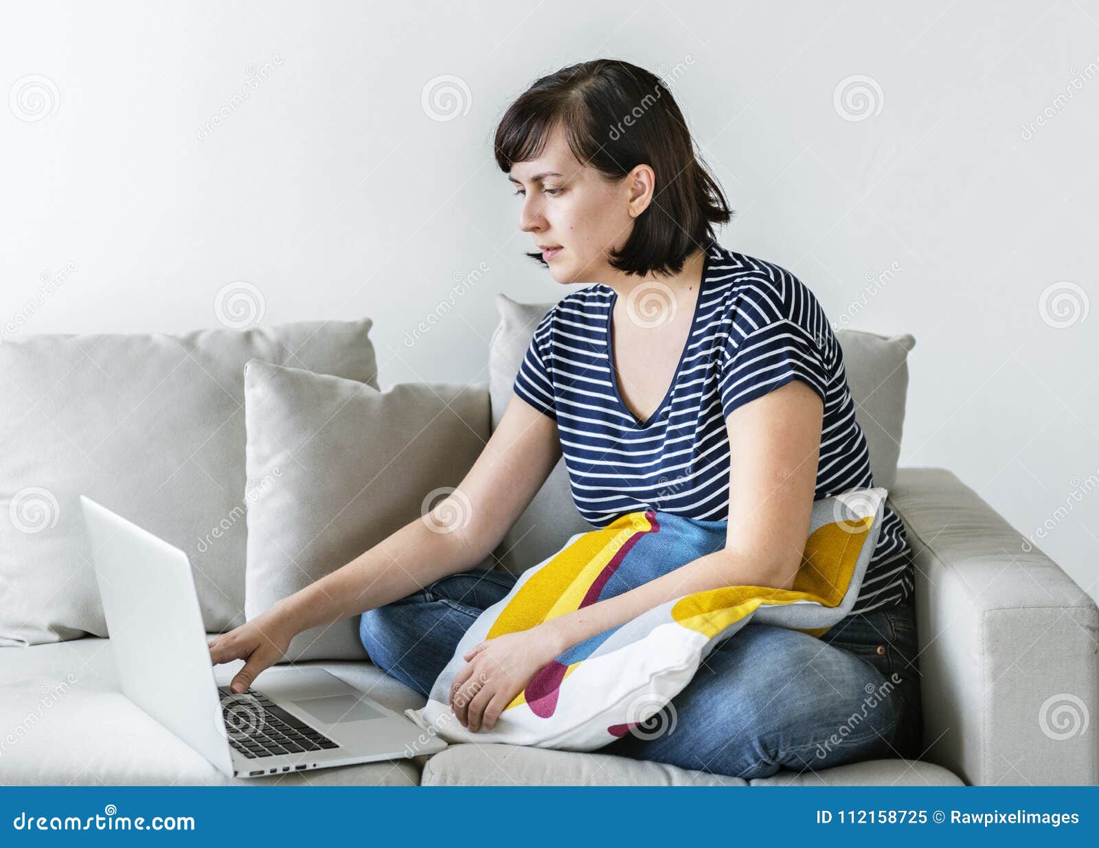 White Woman Using Laptop on Couch Stock Image - Image of emotion, alone ...