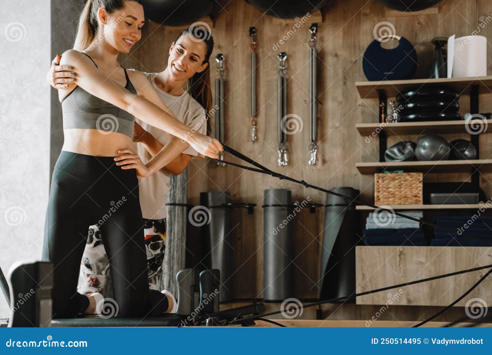 White Woman Working Out on Exercise Machine during Pilates Class Stock ...