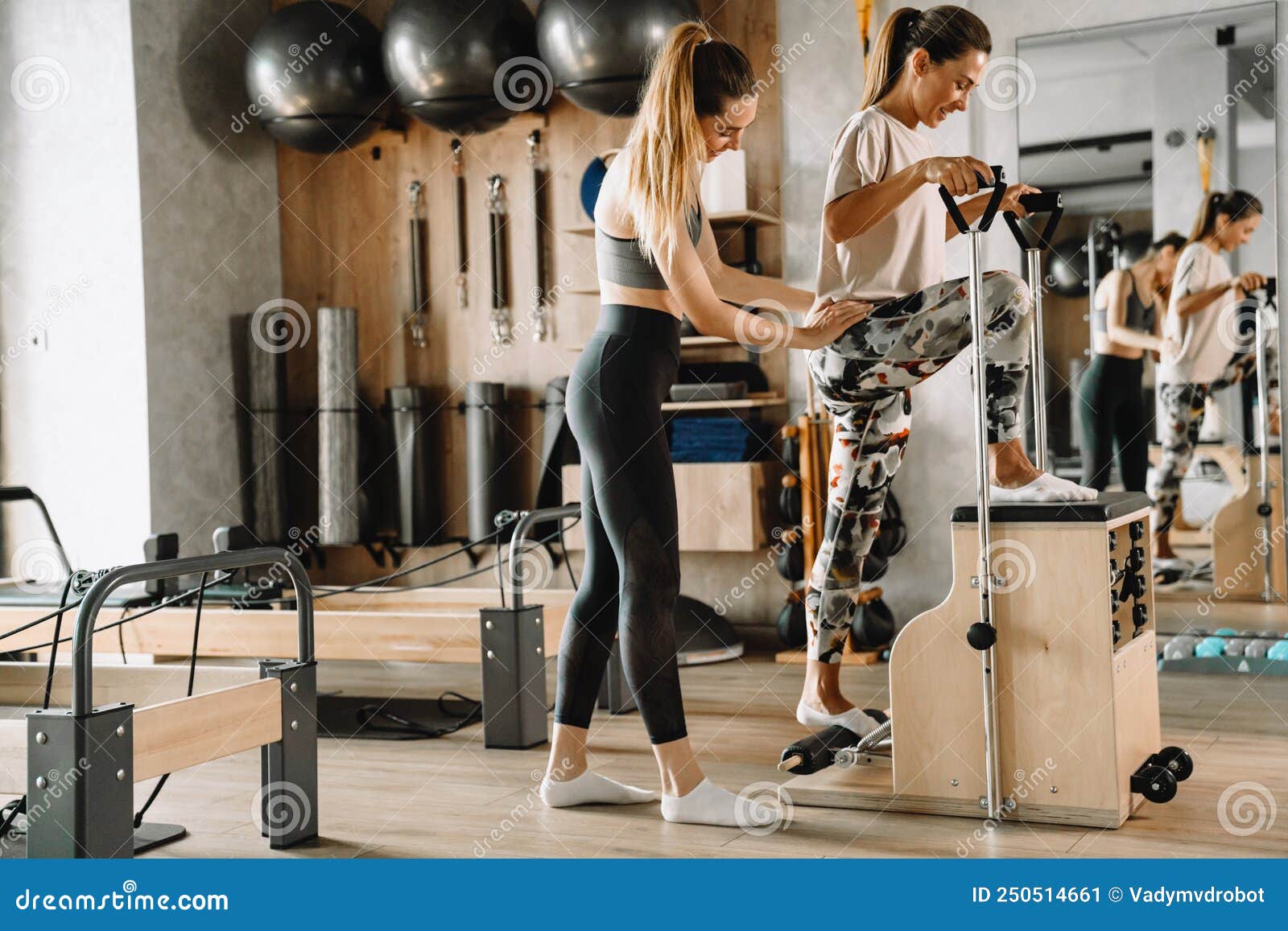 White Woman Working Out on Exercise Machine during Pilates Class Stock ...