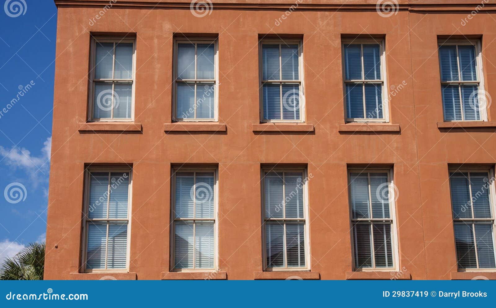 Windows in Old Red Stucco Building Stock Image - Image of city, facade ...