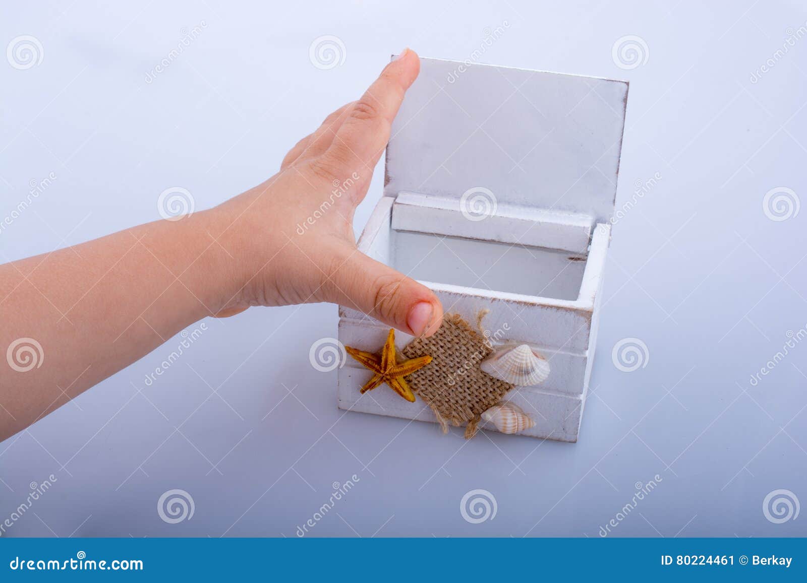 White wooden case in hand stock image. Image of container - 80224461