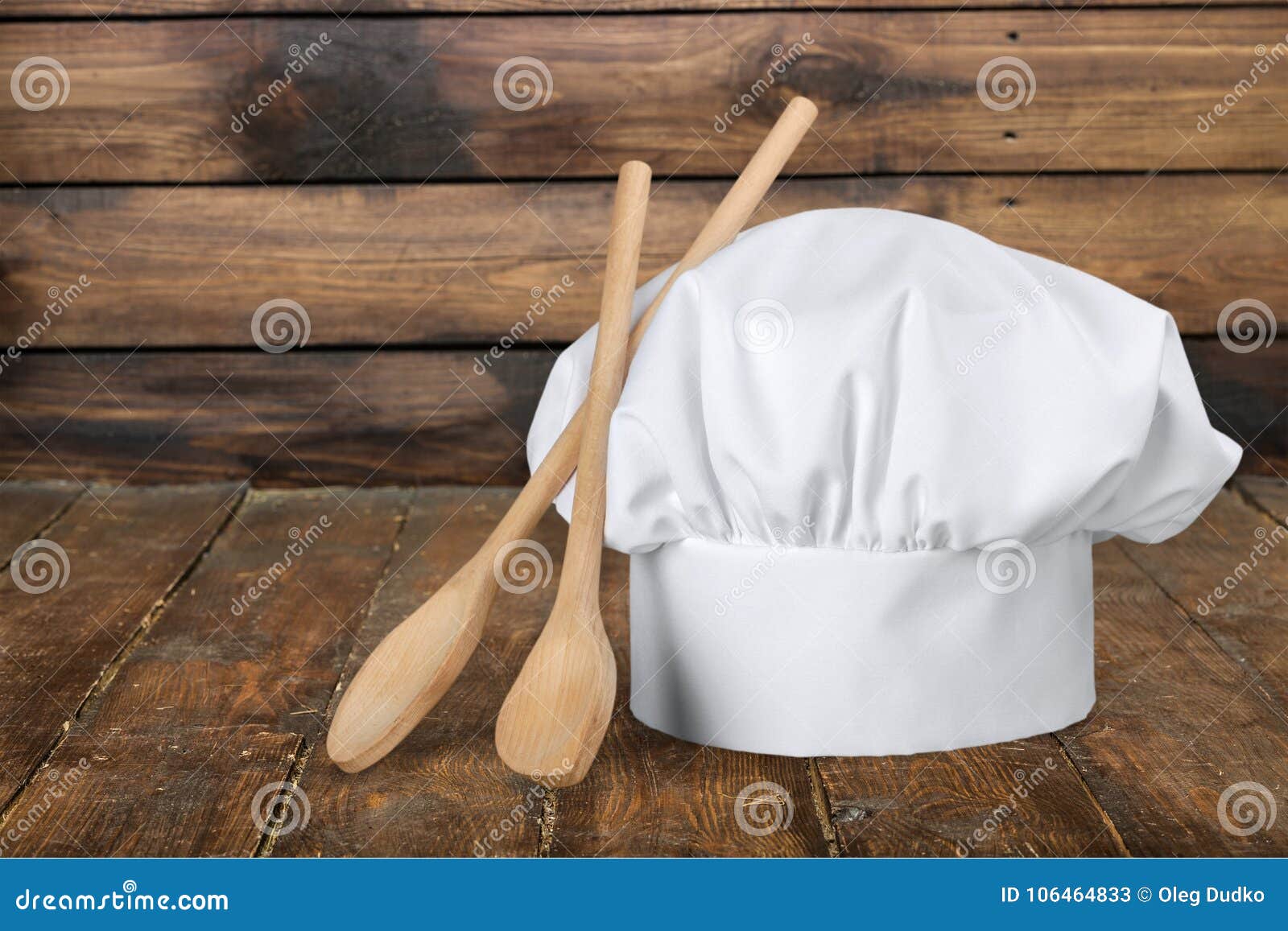 White Cooks Cap and Wooden Spoons on Wooden Table Stock Image - Image ...
