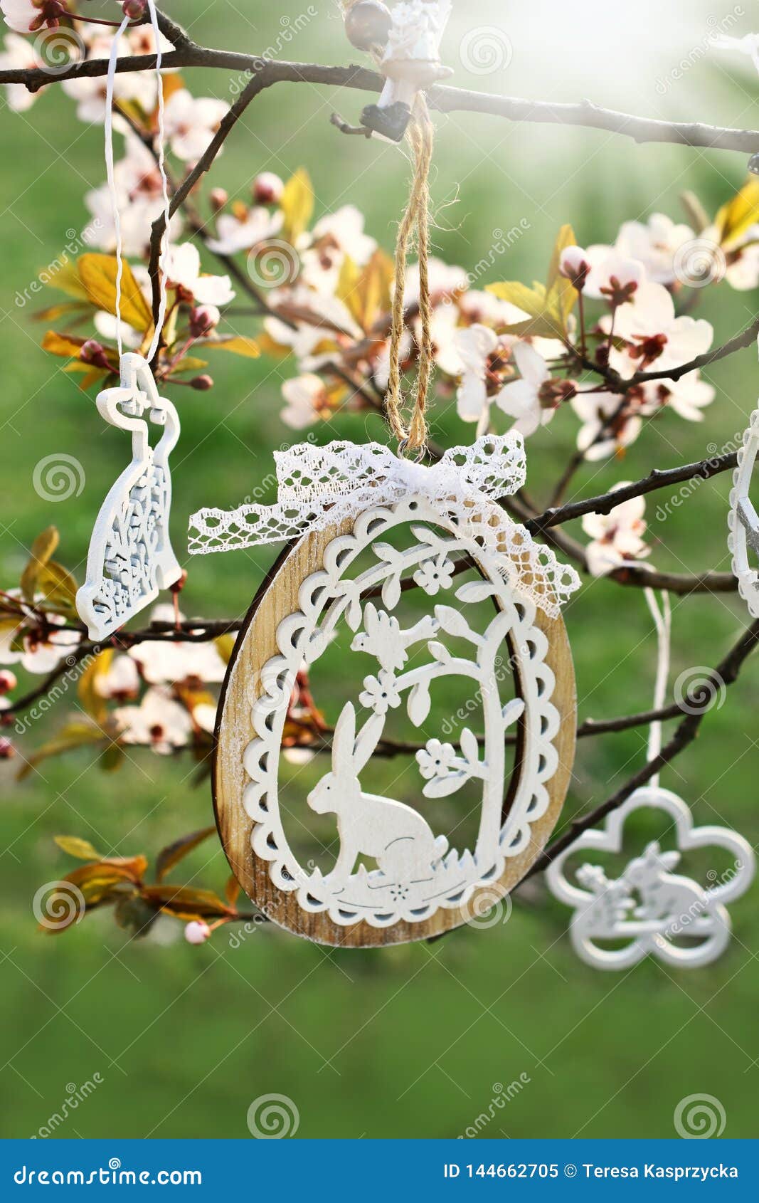 Easter Decorations Hanging on Trees in Spring Blooming Garden Stock ...