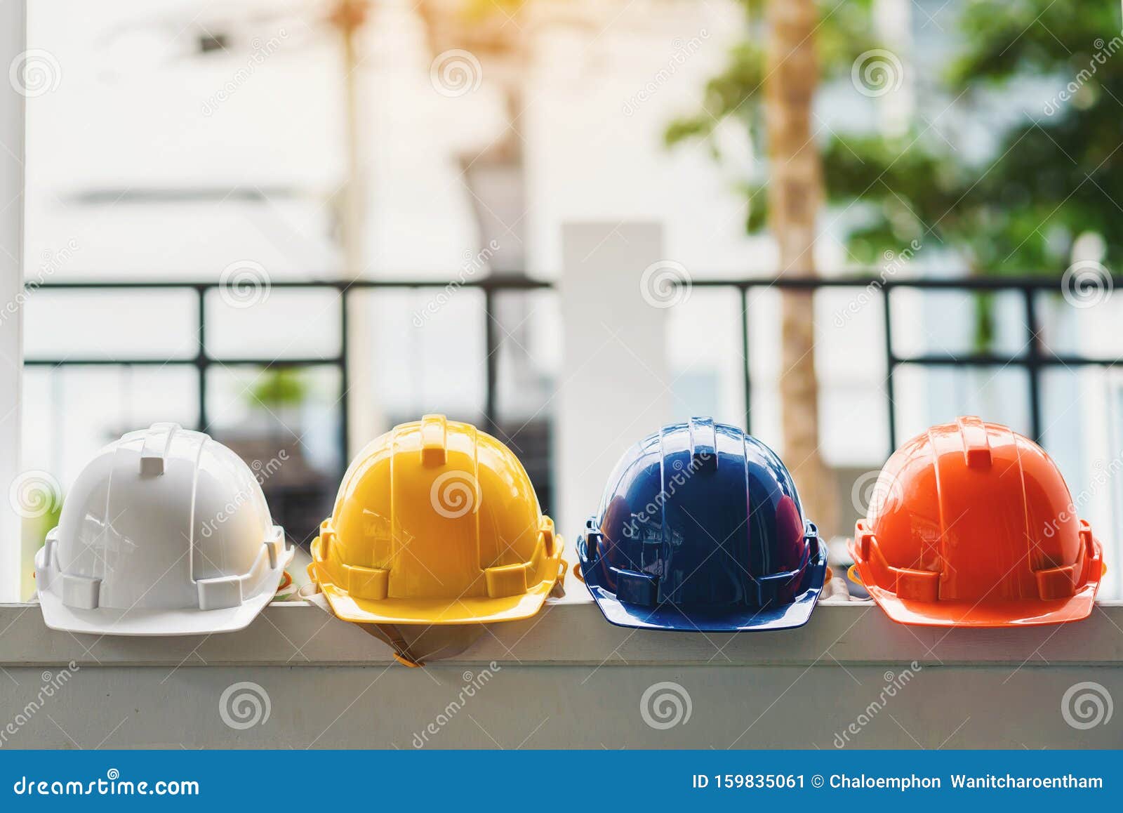 White, Yellow and Other Colored Safety Helmets for Workers` Safety ...