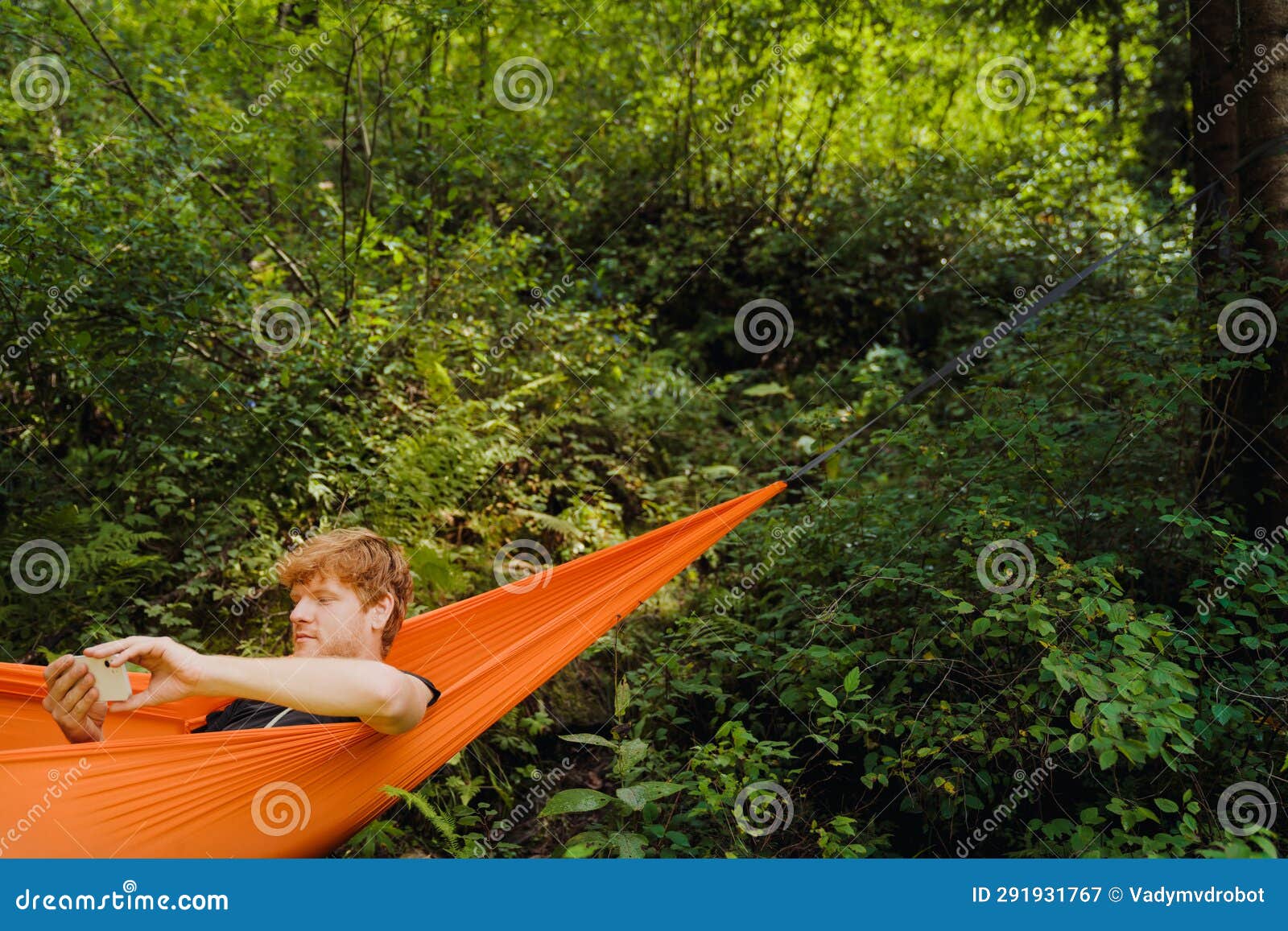 White Young Man Resting in Hammock while Hiking in Green Forest Stock ...