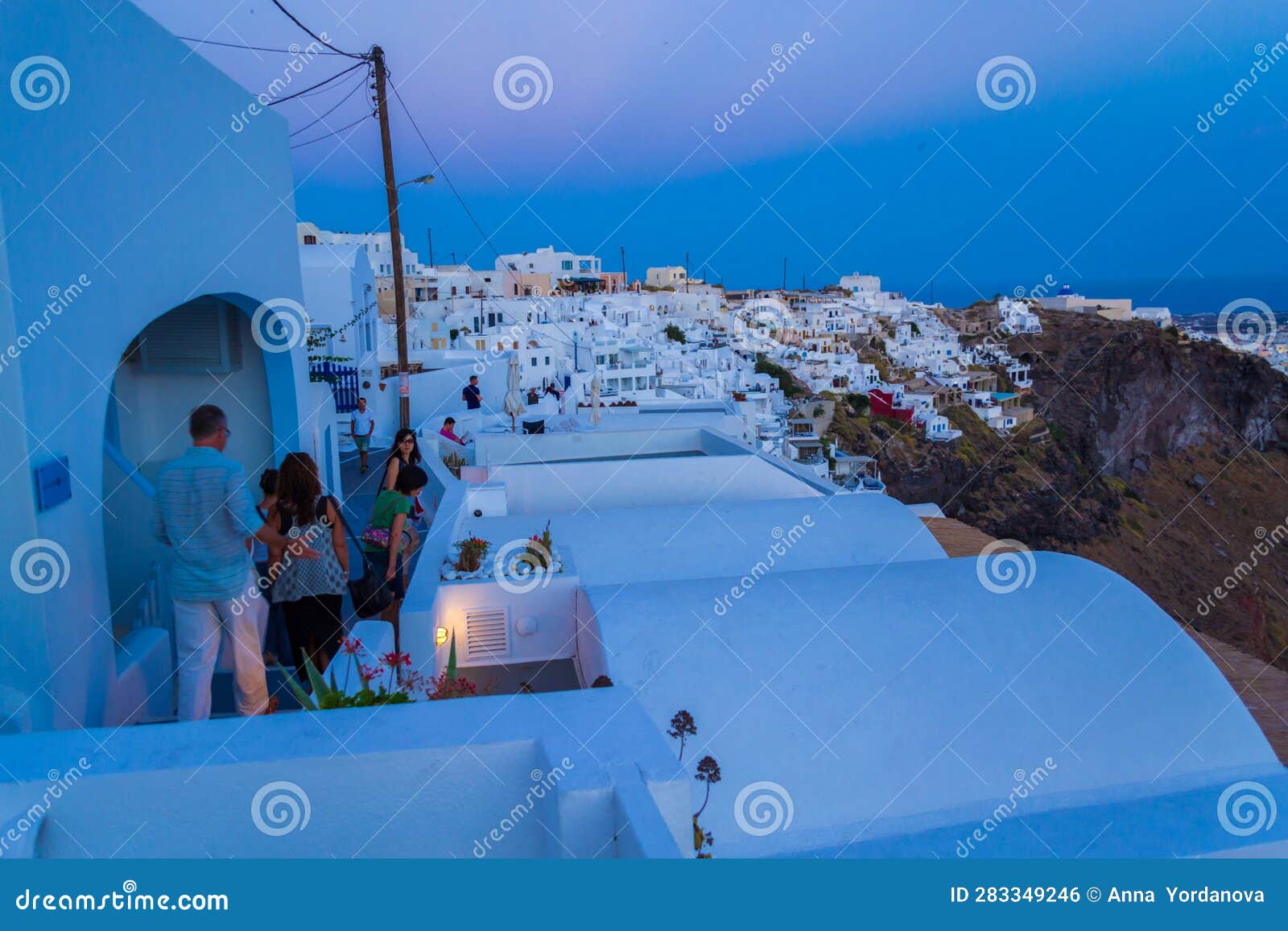 Whitewashed Clifftop Villas Overlooking the Caldera on Twilight ...
