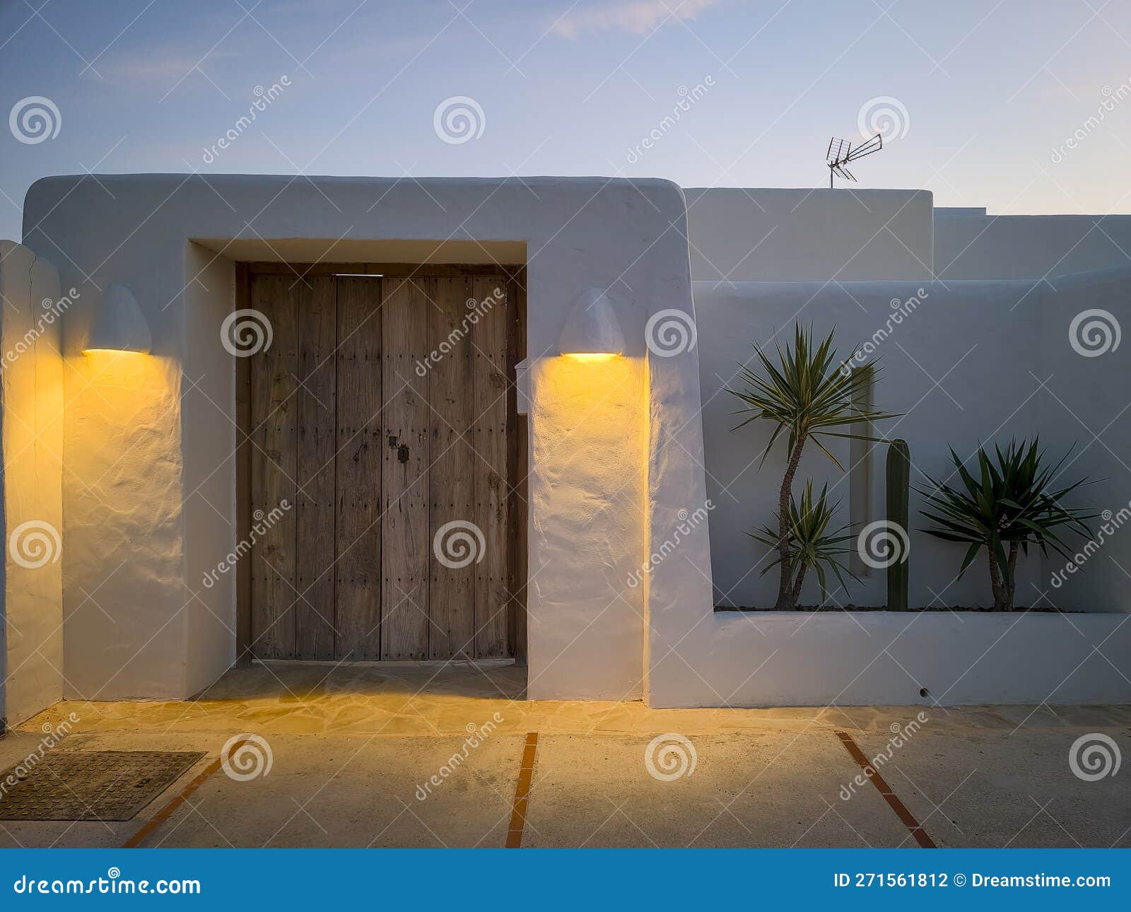 Whitewashed Facade of a Pretty House Illuminated at Sunset Stock Photo ...