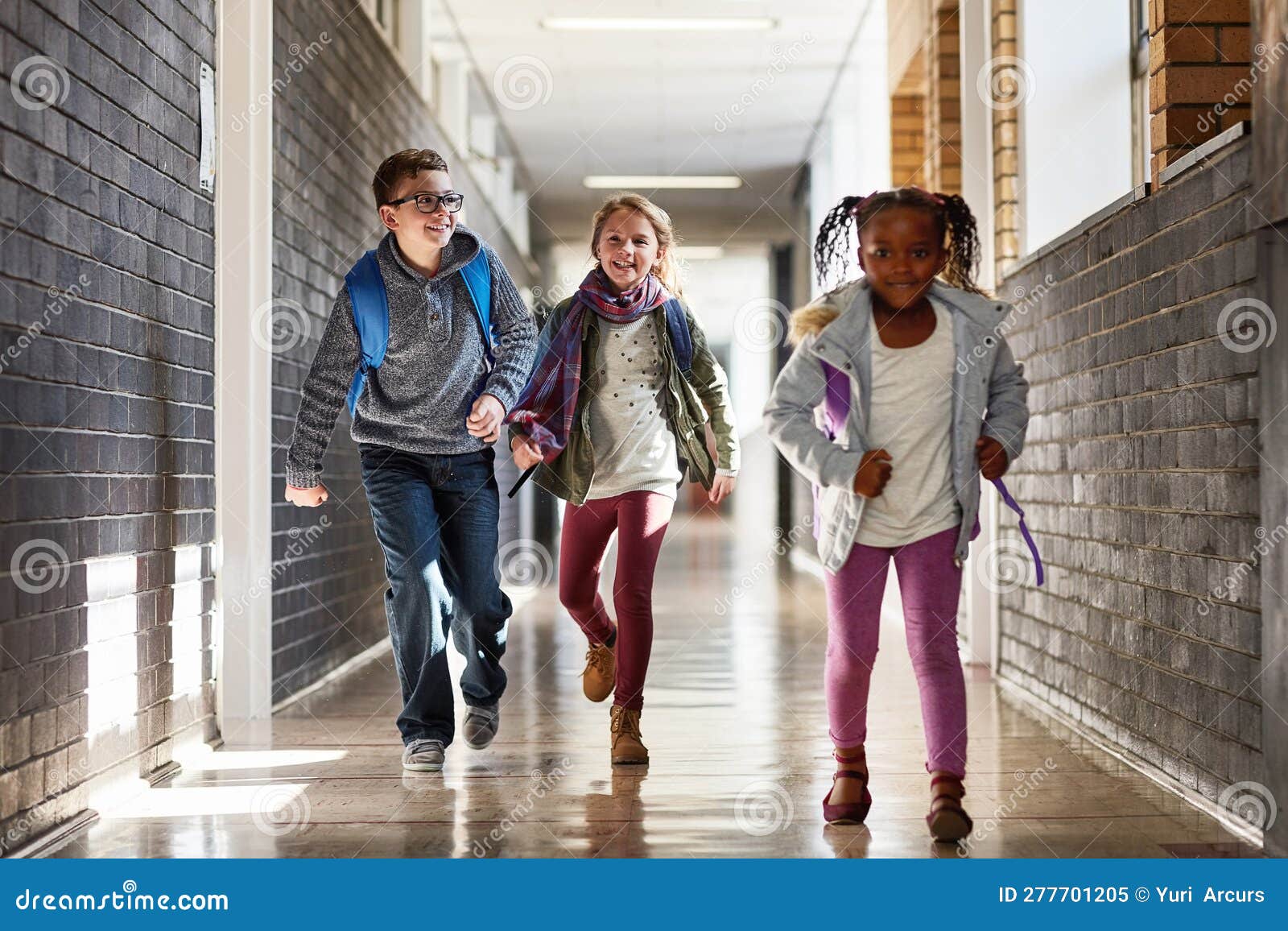 Who Will Get To Class First. Elementary School Kids Running in the ...
