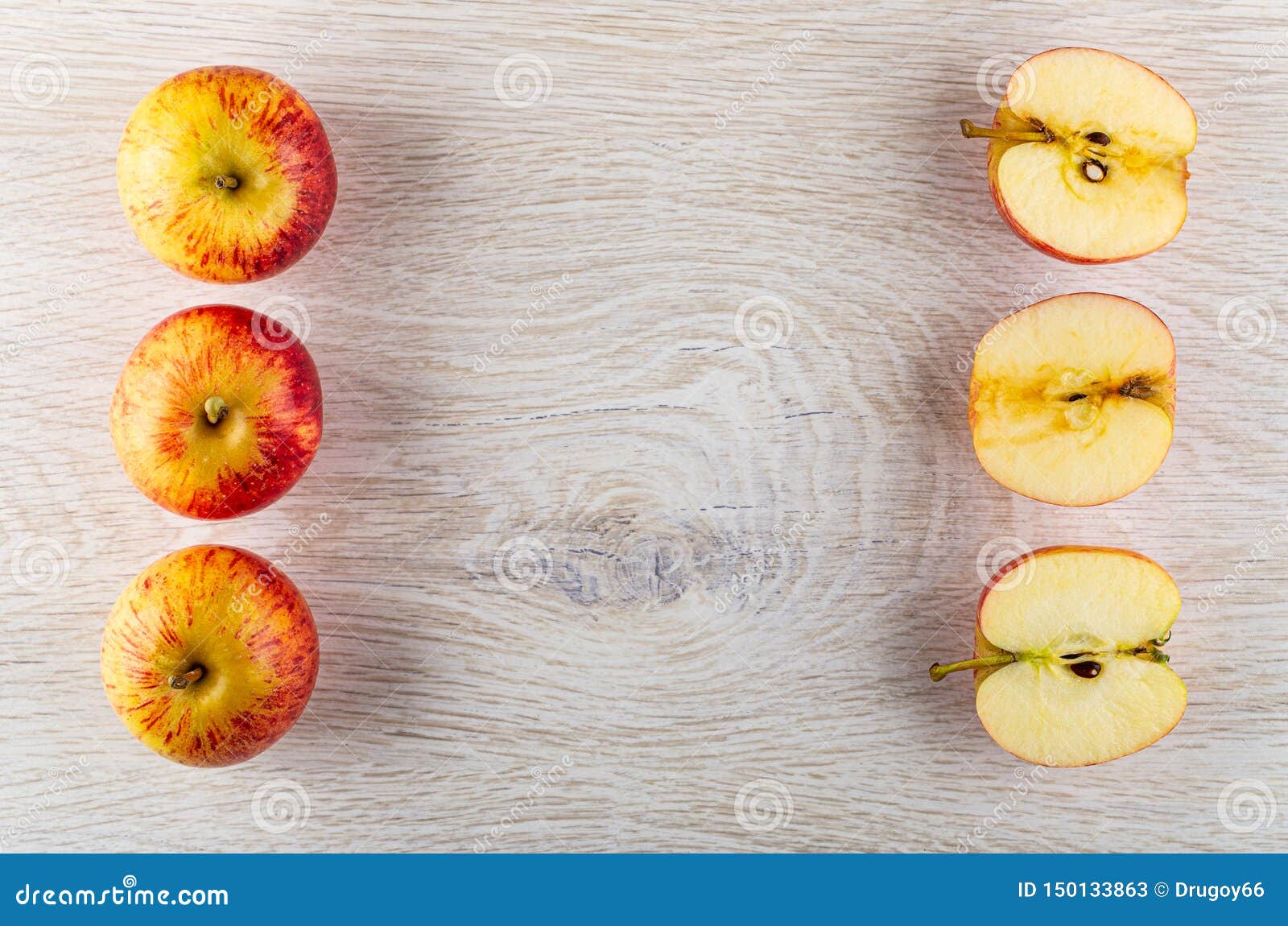 Whole Apples from Left Side, Halves of Apples from Right Side on Table ...