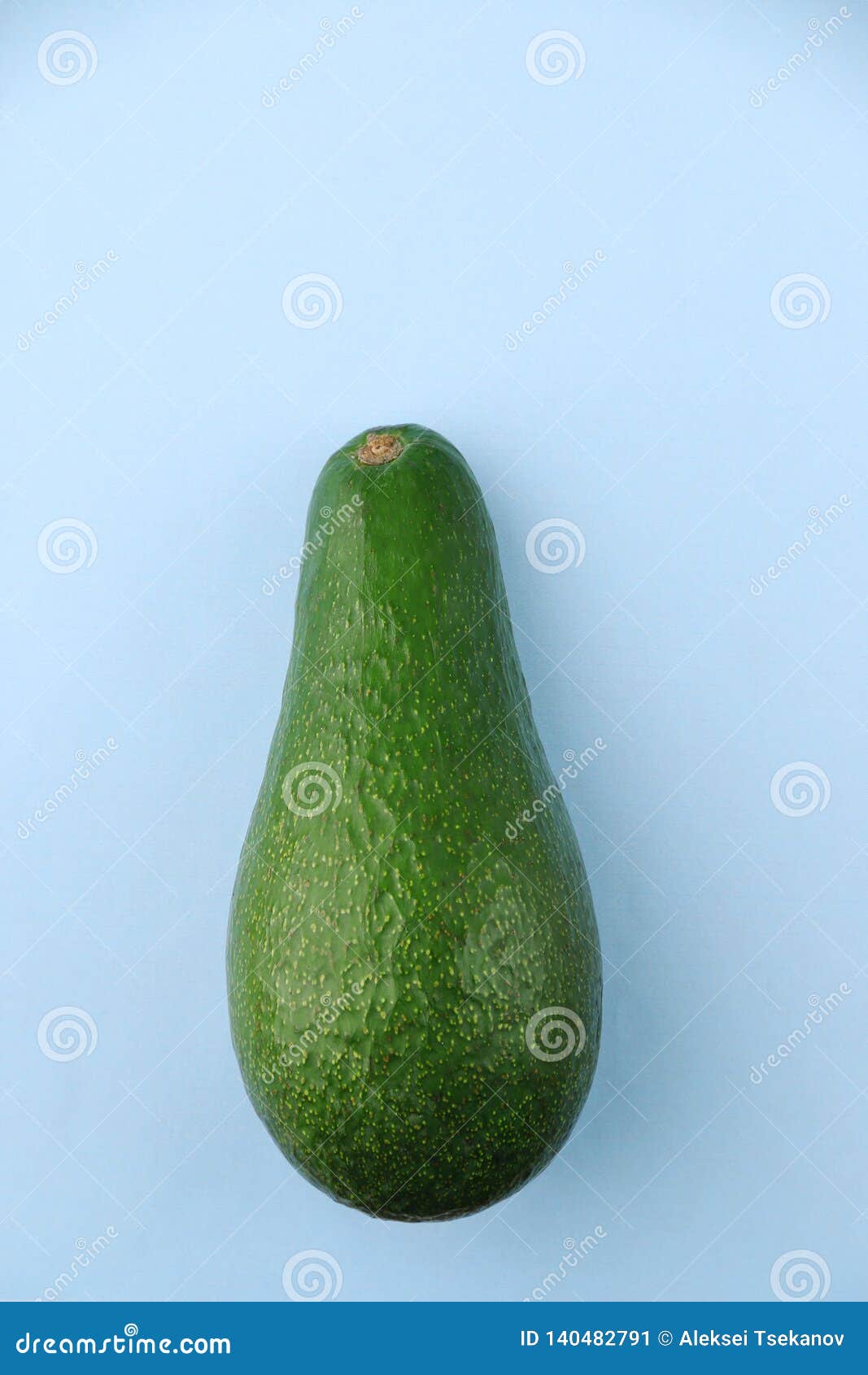 Whole Avocado on a Light Blue Background Stock Image - Image of ...