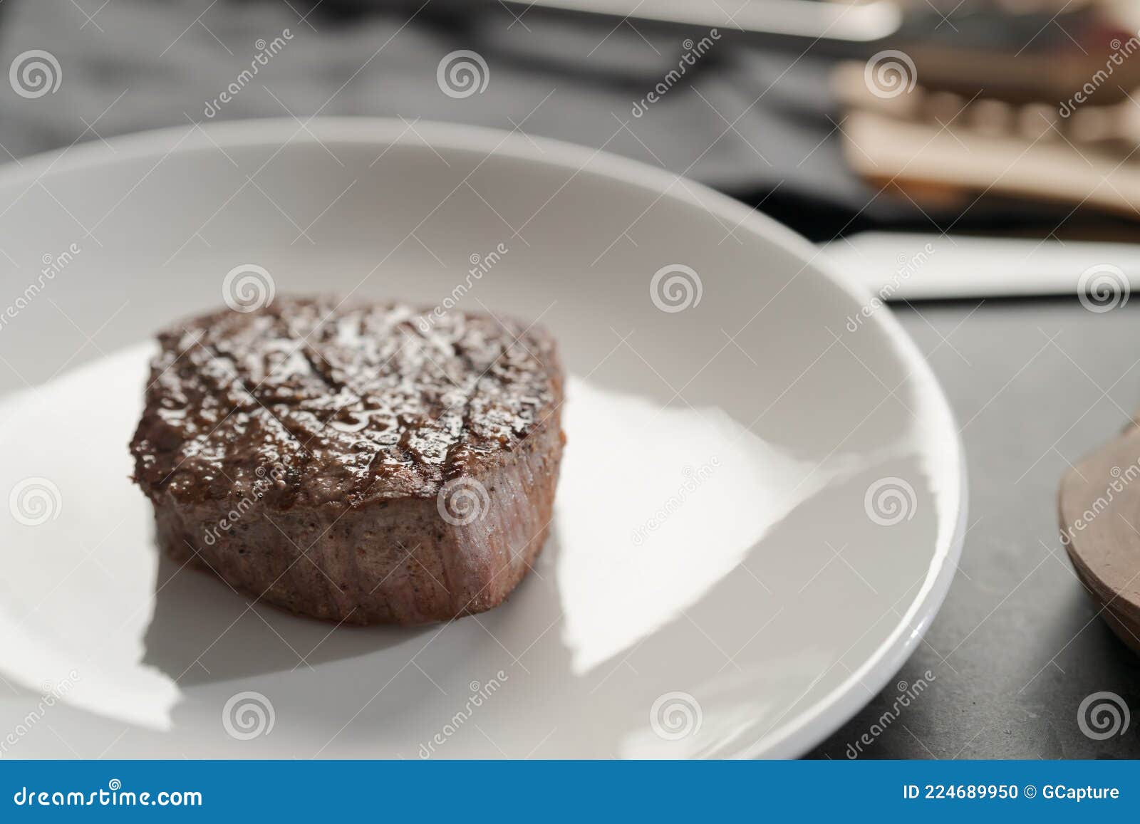 Whole Beef Steak on White Plate Stock Photo - Image of barbecue ...