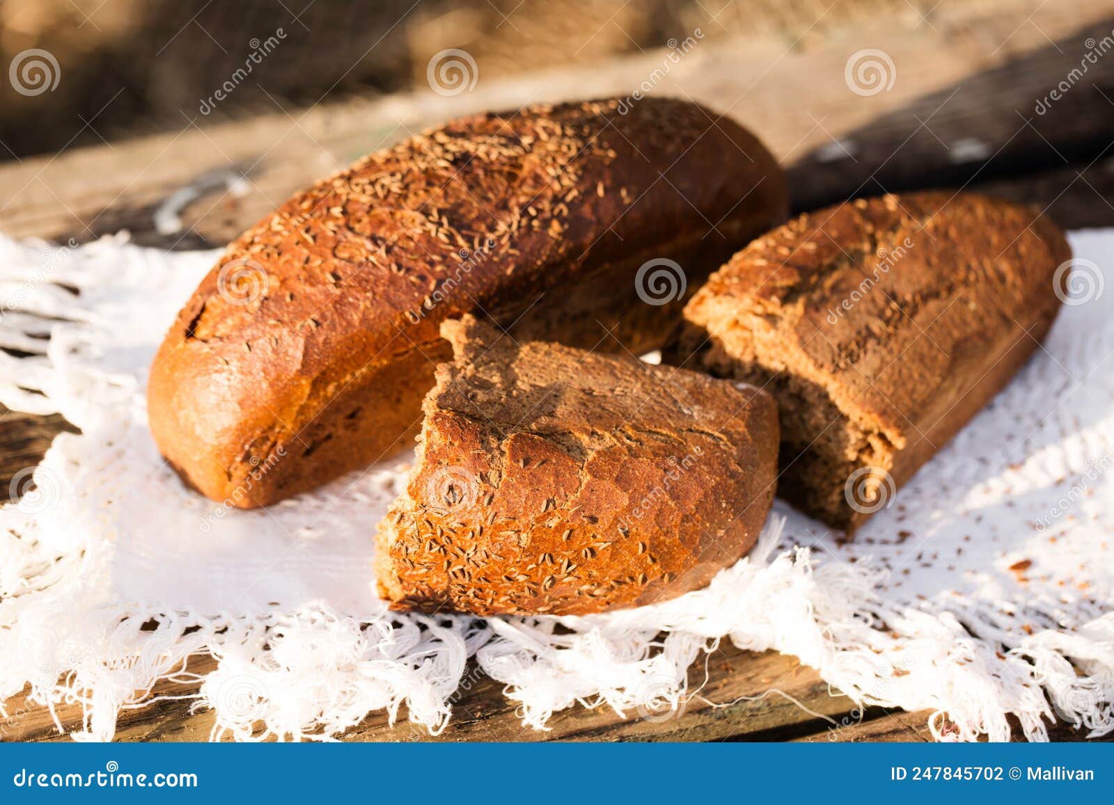 Whole and Broken Loaf of Bread Stock Photo - Image of crusty, natural ...