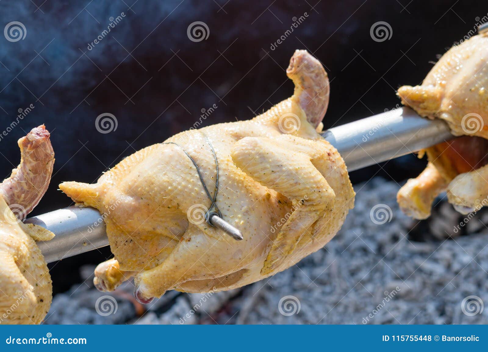 Whole chicken on the spit stock photo. Image of lunch - 115755448