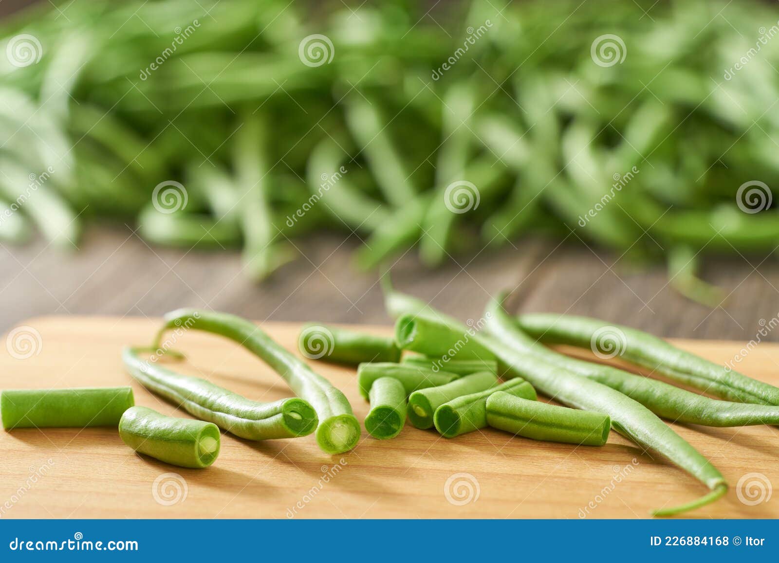 Whole and Chopped Green Beans on a Cutting Board, Close Up Stock Photo ...