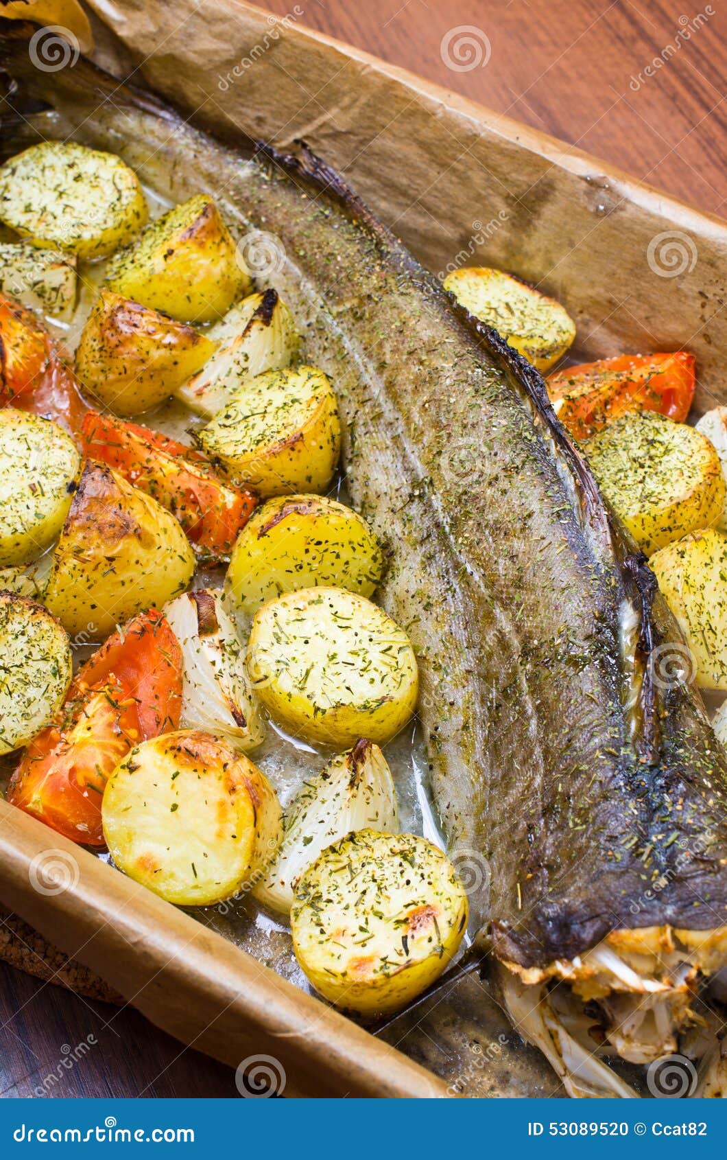 Whole cod with vegetables stock photo. Image of onion - 53089520