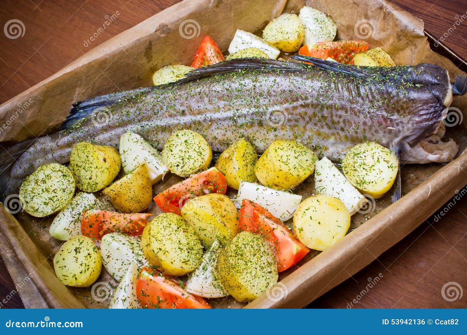 Whole cod with vegetables stock photo. Image of meal - 53942136