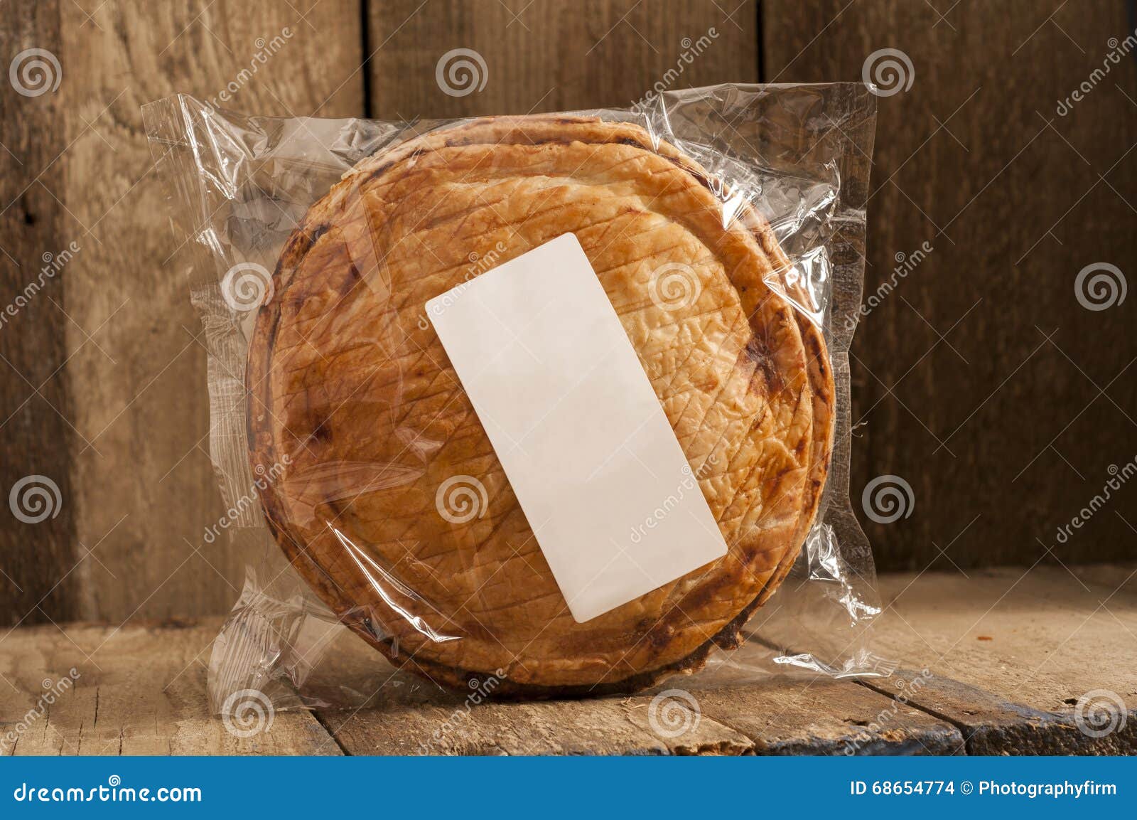 Whole Cooked Pie in Plastic Packaging Stock Photo - Image of cooking ...