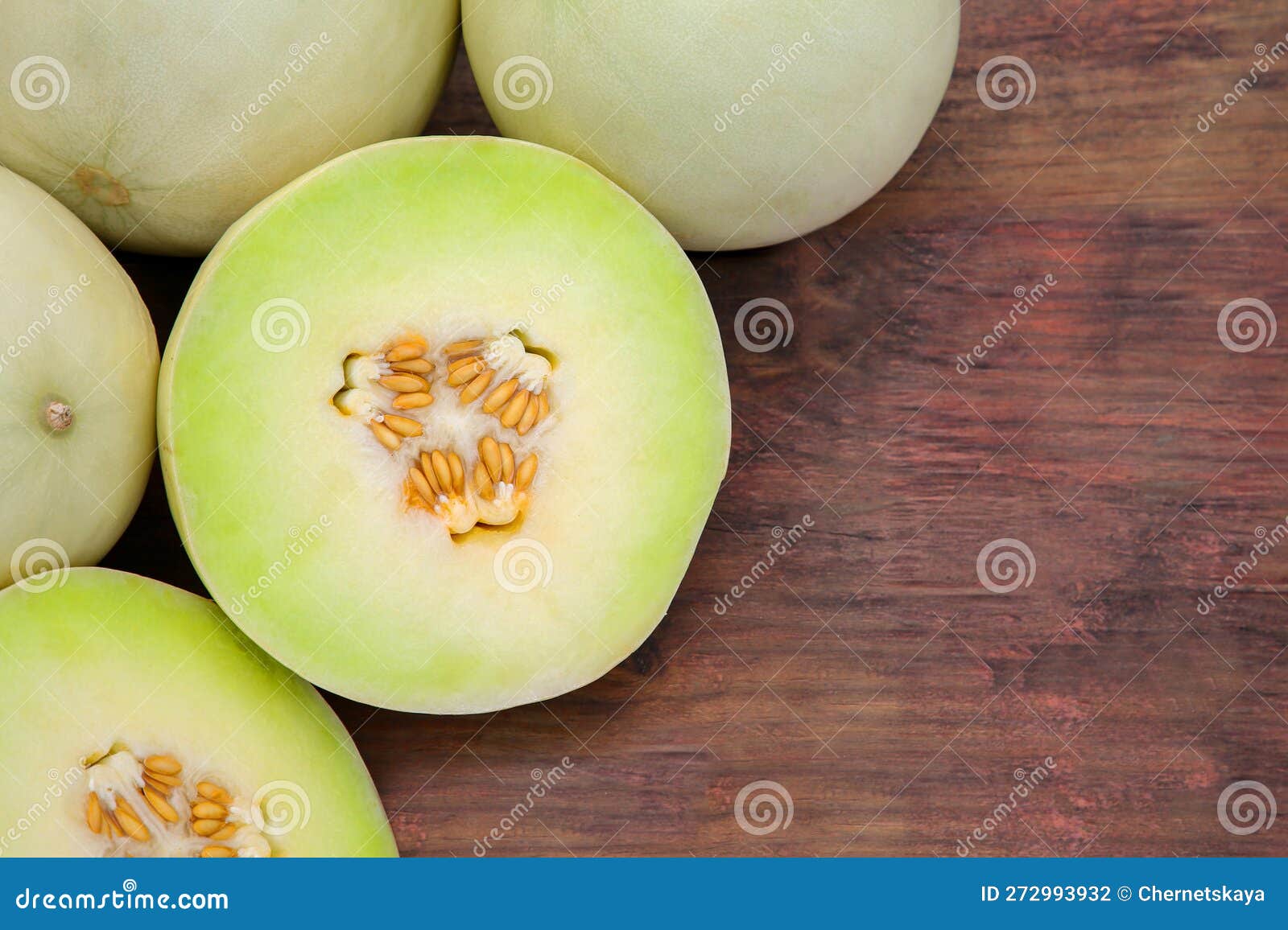 Whole and Cut Fresh Ripe Melons on Wooden Table, Flat Lay. Space for ...