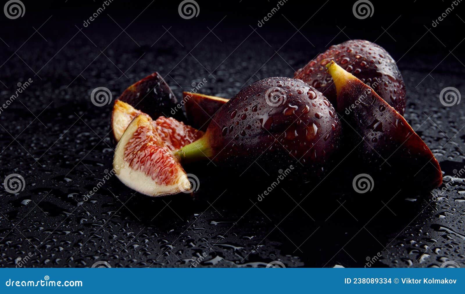Whole and Cut into Pieces of Figs. Ripe Figs with Water Drops on the ...