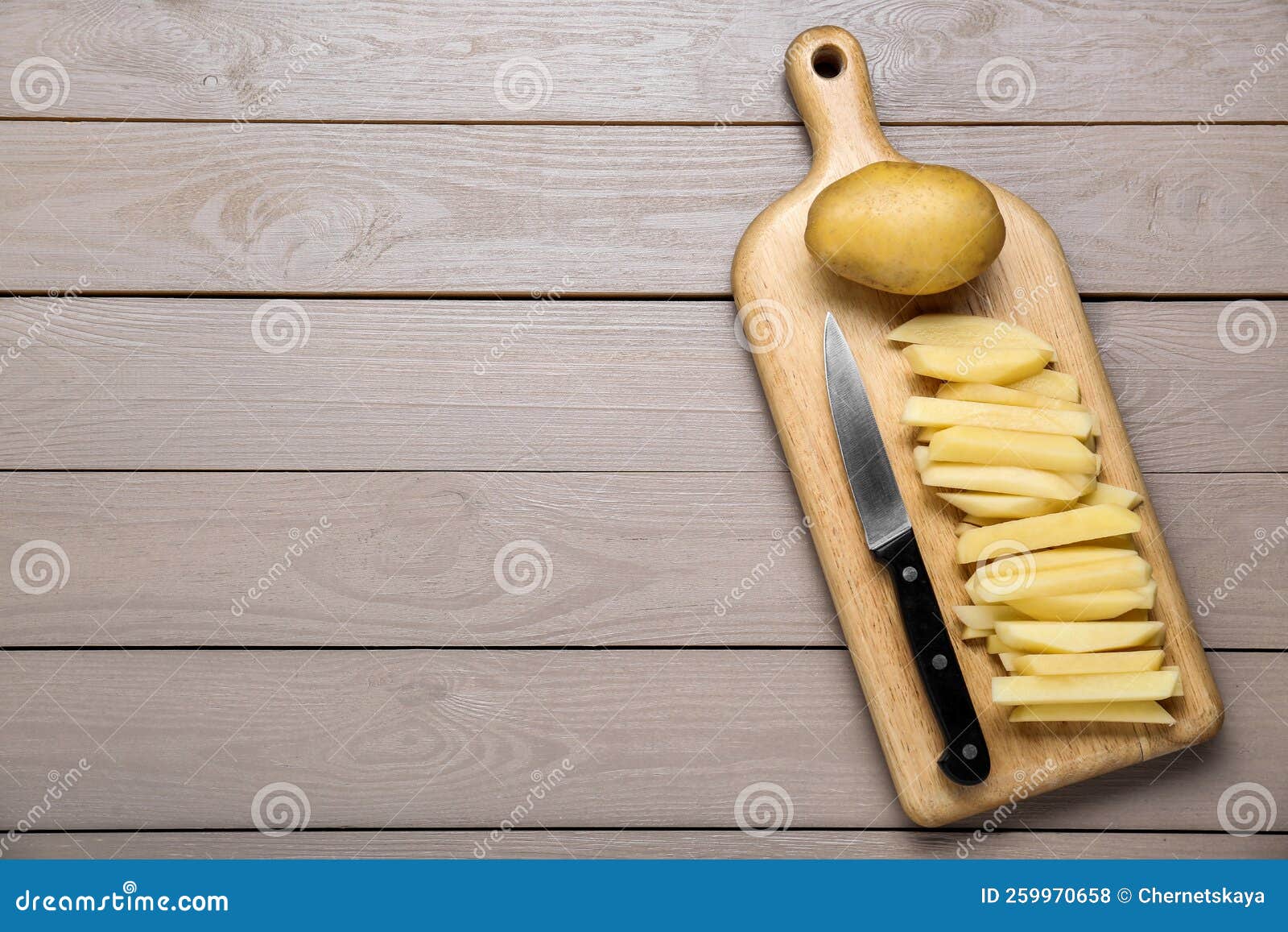 Whole and Cut Raw Potatoes on Wooden Table, Top View. Space for Text ...