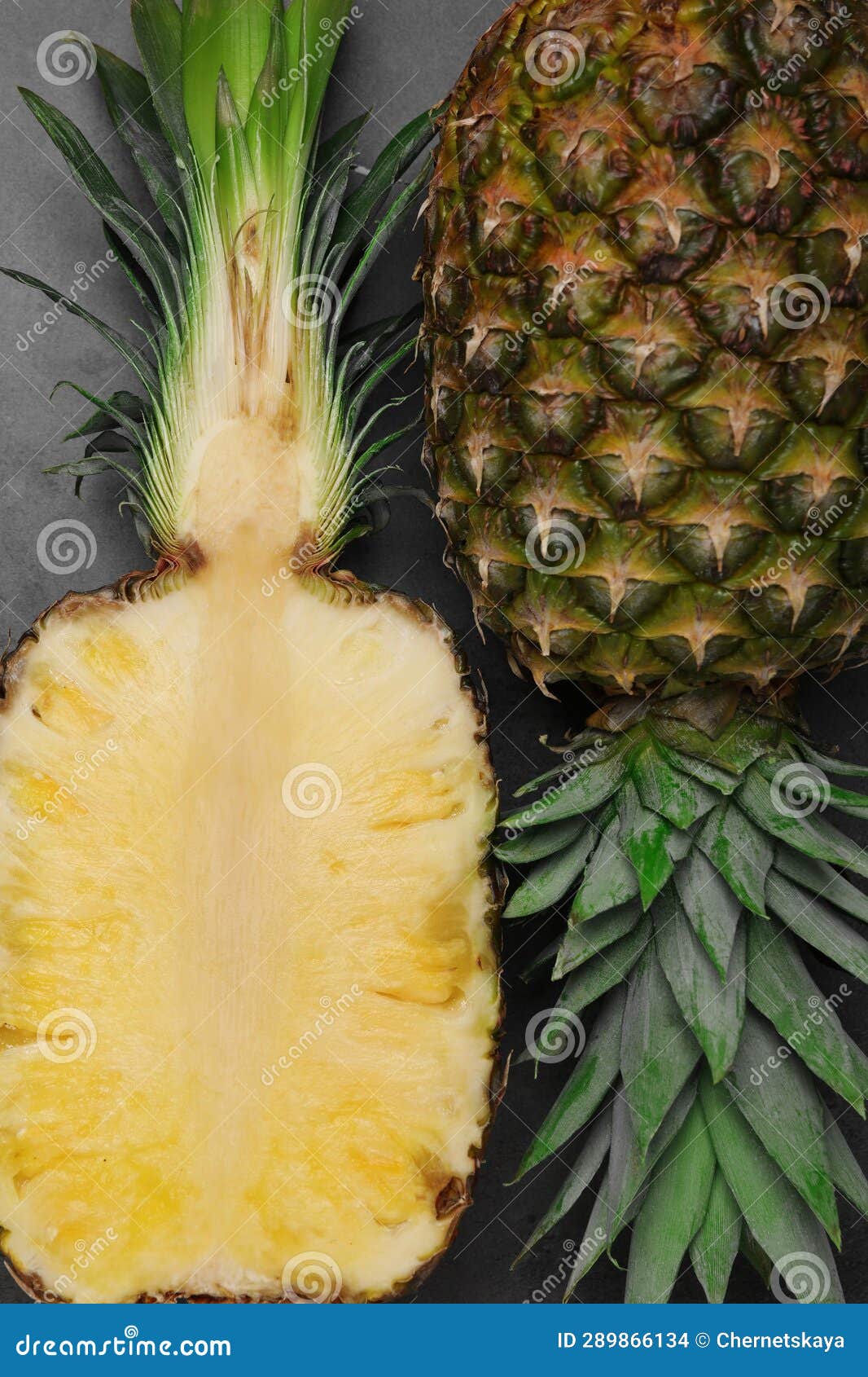 Whole and Cut Ripe Pineapples on Grey Table, Flat Lay Stock Photo ...
