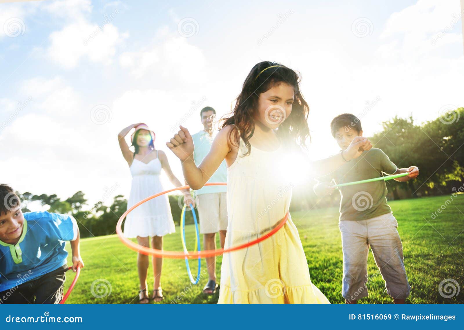 Whole Family Hula Hooping Outdoors Togetherness Concept Stock Image ...
