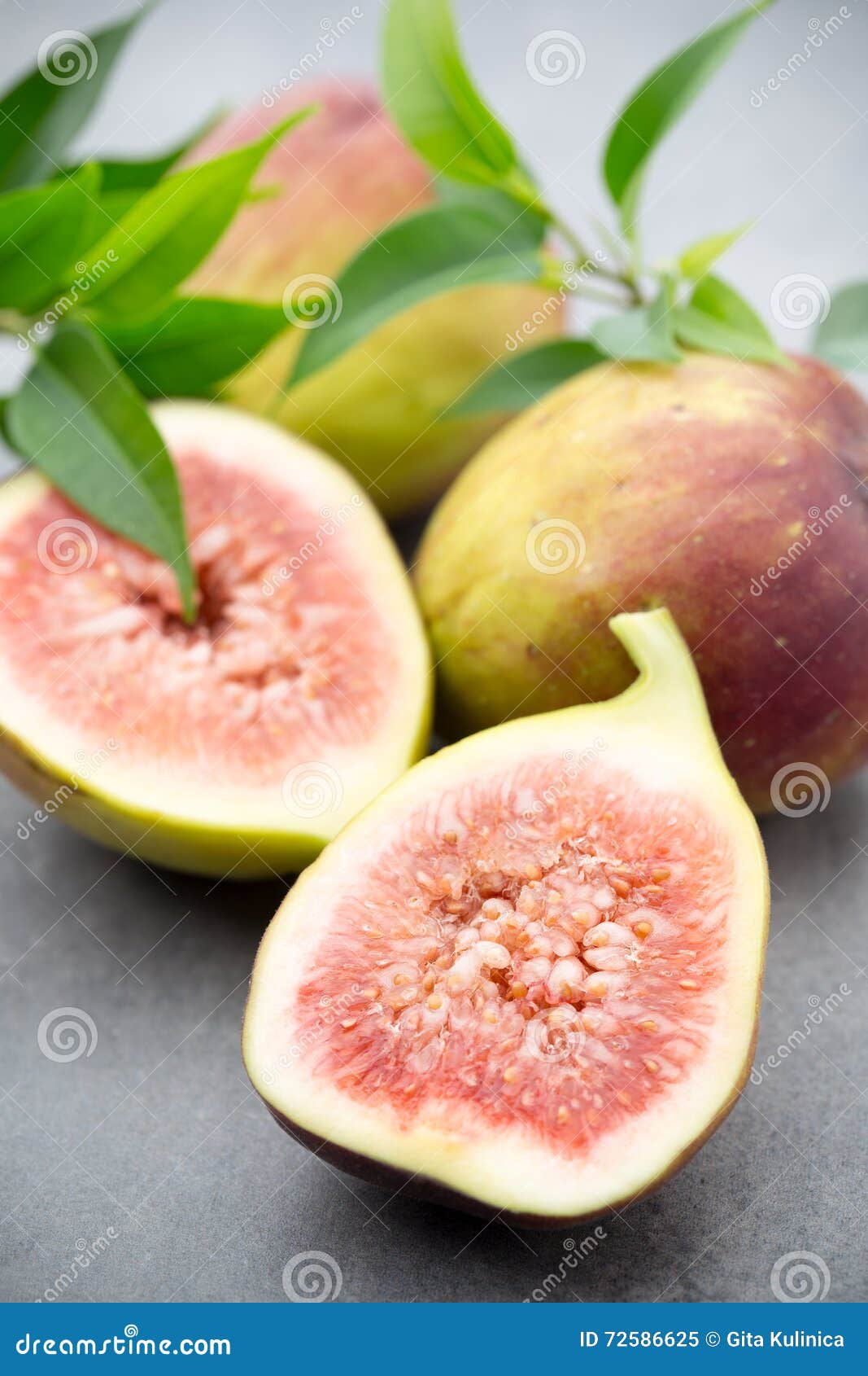 Whole Figs and One Fig Sliced in Half on Top of a Gray Table. Stock ...