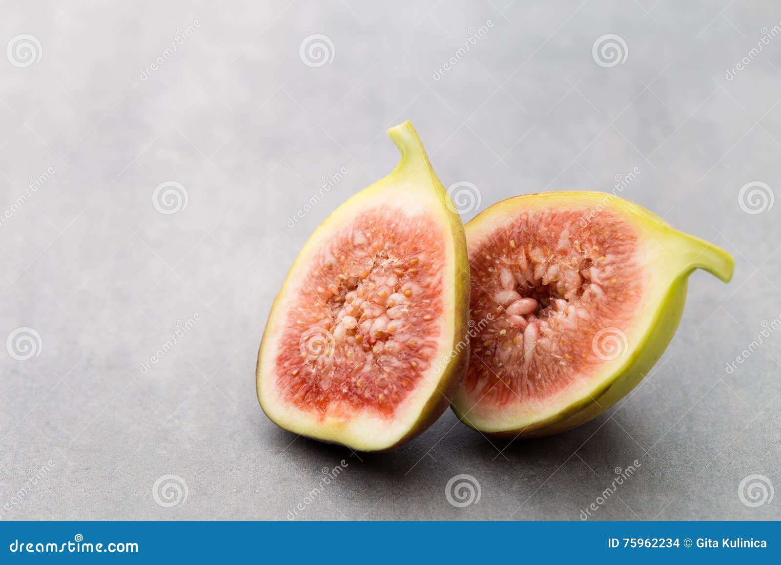 Whole Figs and One Fig Sliced in Half on Top of a Gray Table. Stock ...