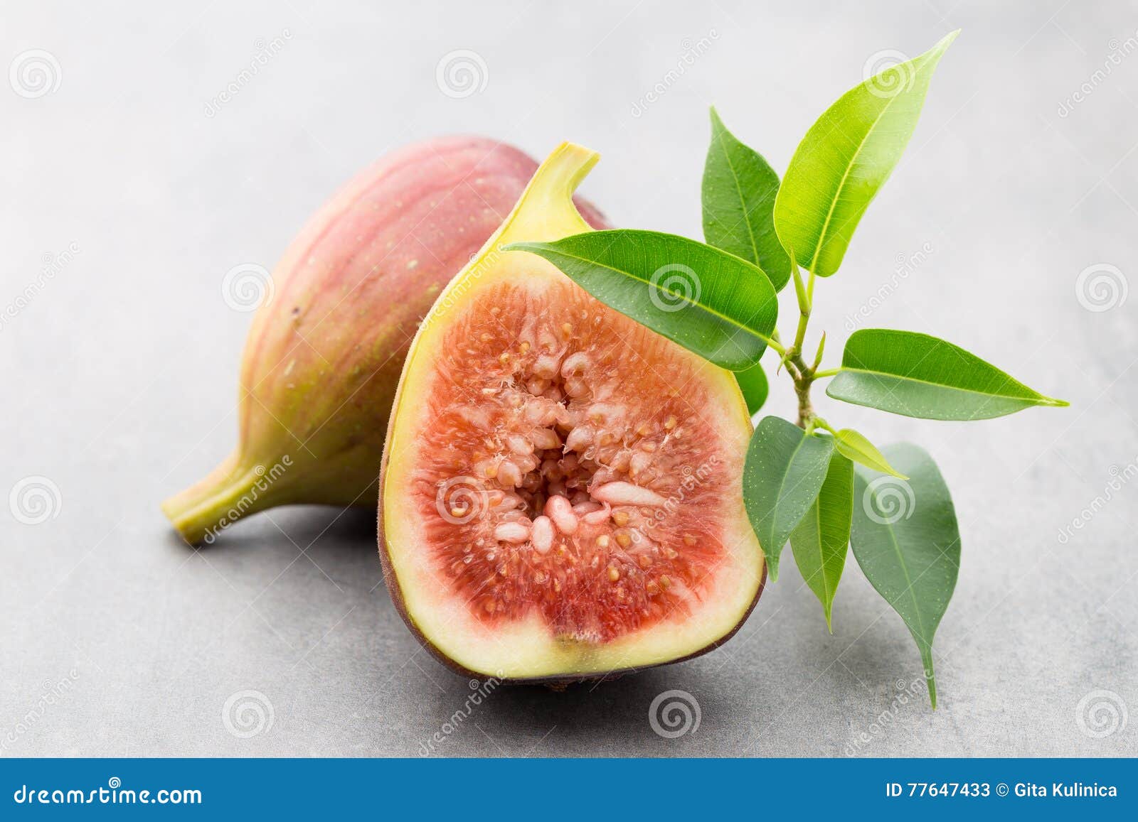 Whole Figs and One Fig Sliced in Half on Top of a Gray Table. Stock ...