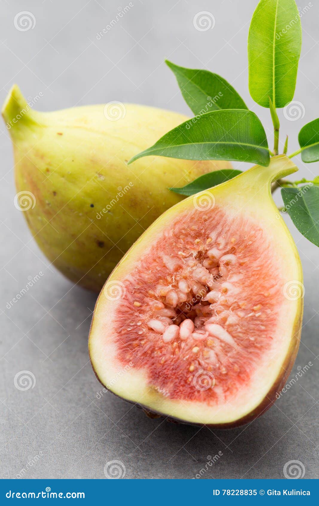 Whole Figs and One Fig Sliced in Half on Top of a Gray Table. Stock ...