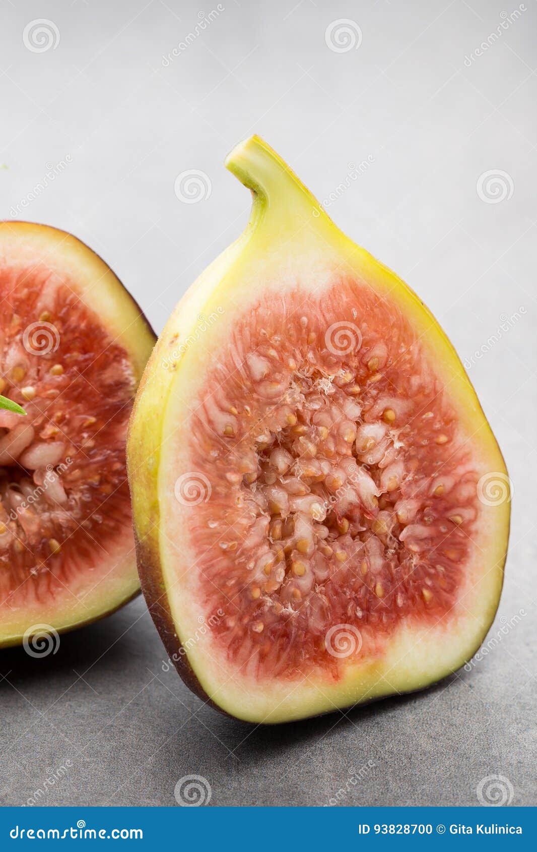 Whole Figs and One Fig Sliced in Half on Top of a Gray Table. Stock ...