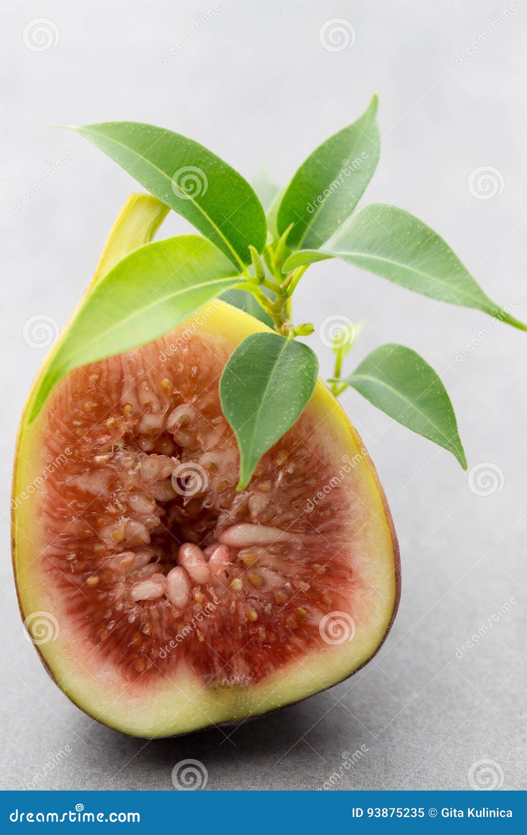 Whole Figs and One Fig Sliced in Half on Top of a Gray Table. Stock ...