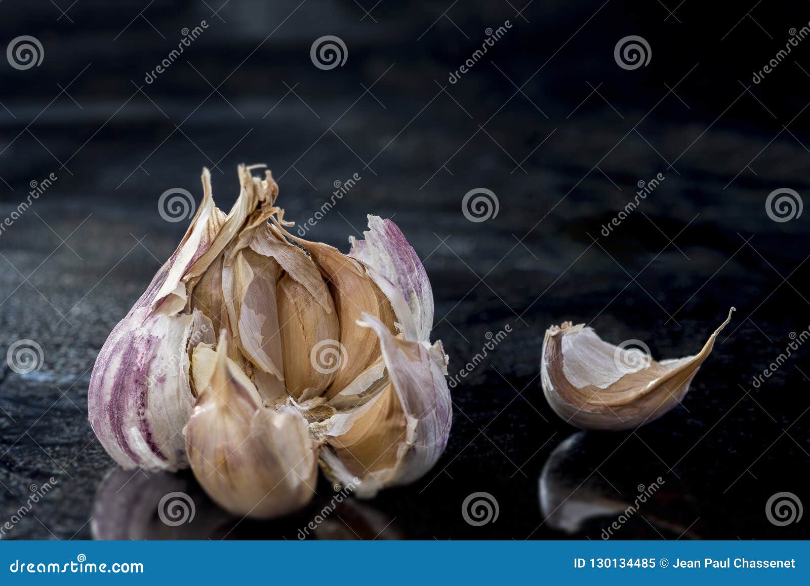 Whole Garlic Bulb Close-up on Black Background. Stock Image - Image of ...