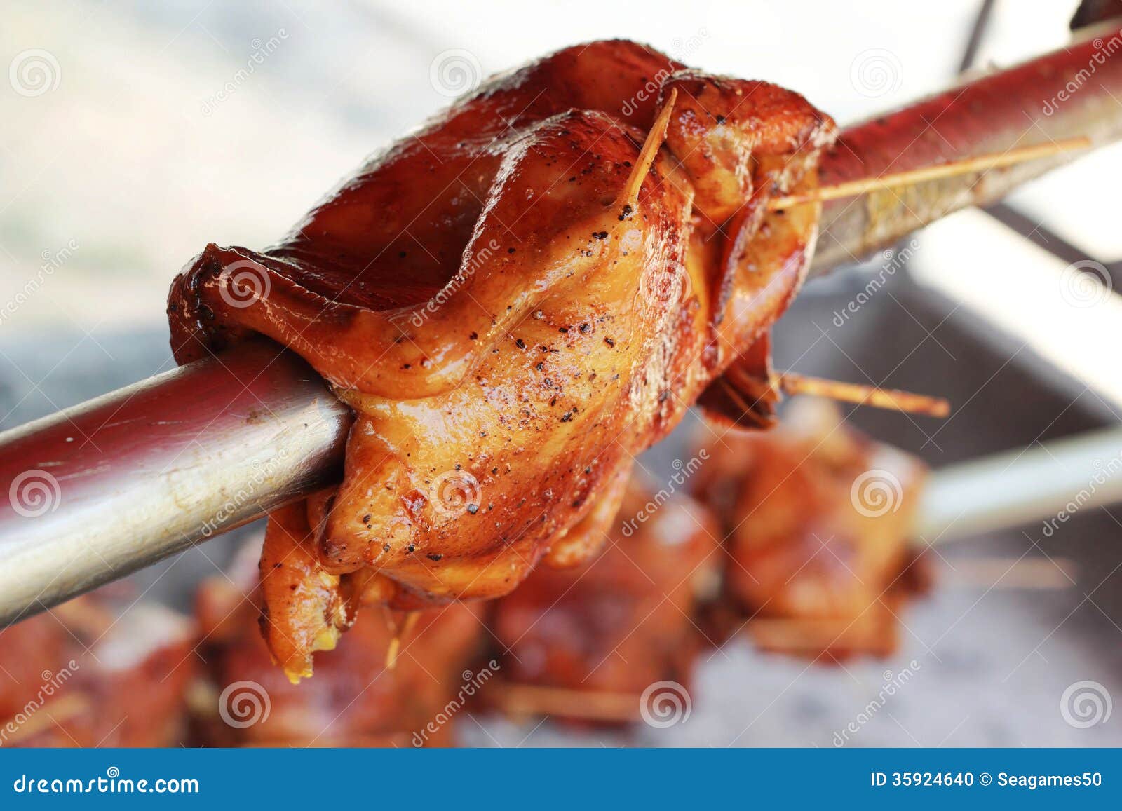 Whole Grilled Chicken on a Grill with Rotating Steel Plug. Stock Photo ...