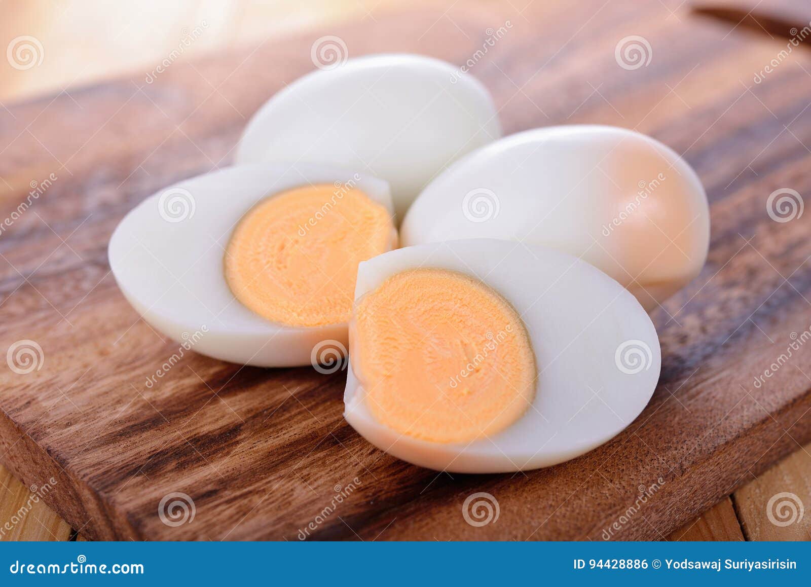 Whole and Haft Cut Boiled Eggs without Shell on Wooden Board Stock ...